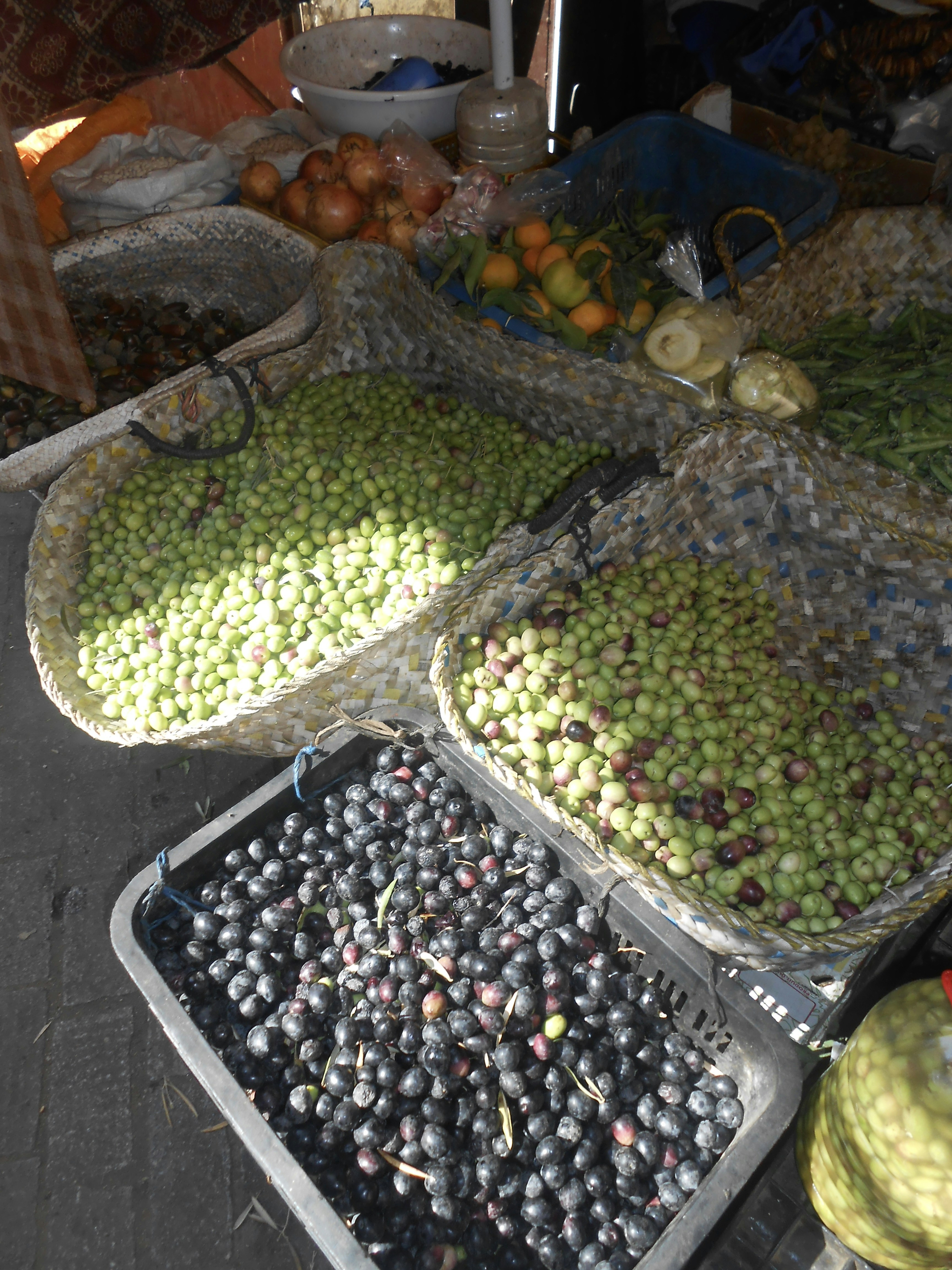 Market Baskets Overflowing with Fresh Olives and Produce