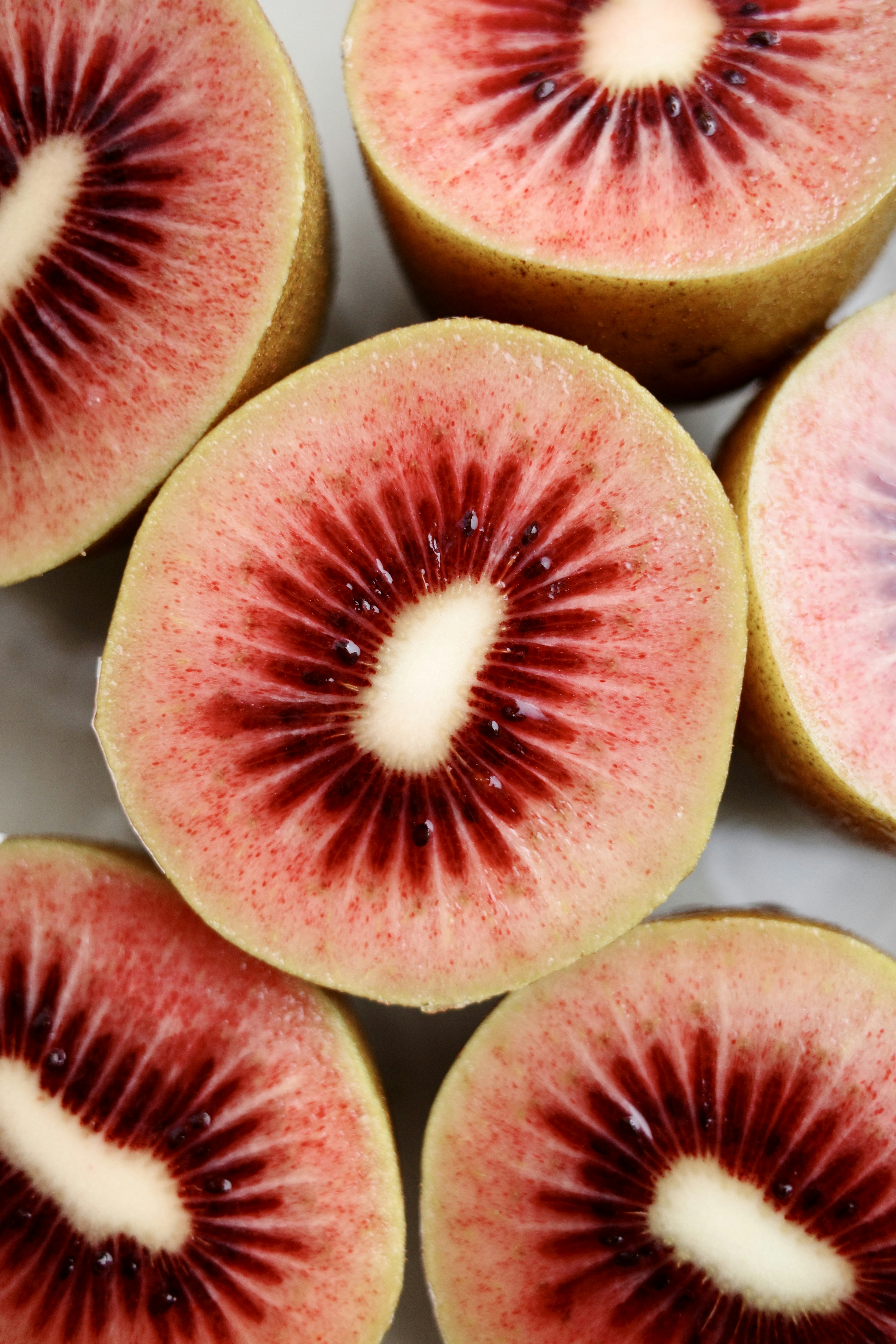 Cross-section of Summer: Juicy Kiwi-Red Relics in Blooming Rosy Interior
