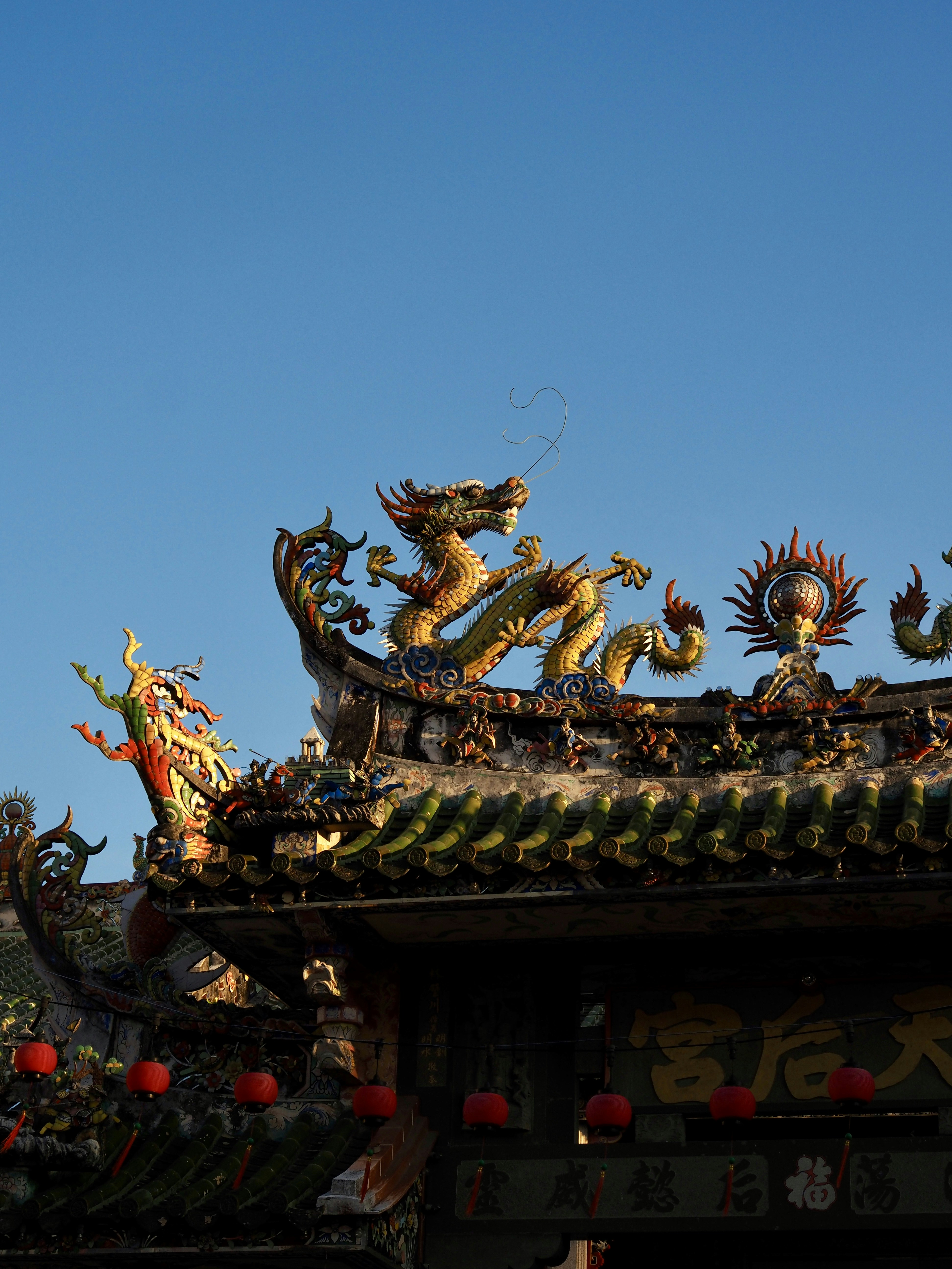 Dragon Crest Over Courtyard Rooflines