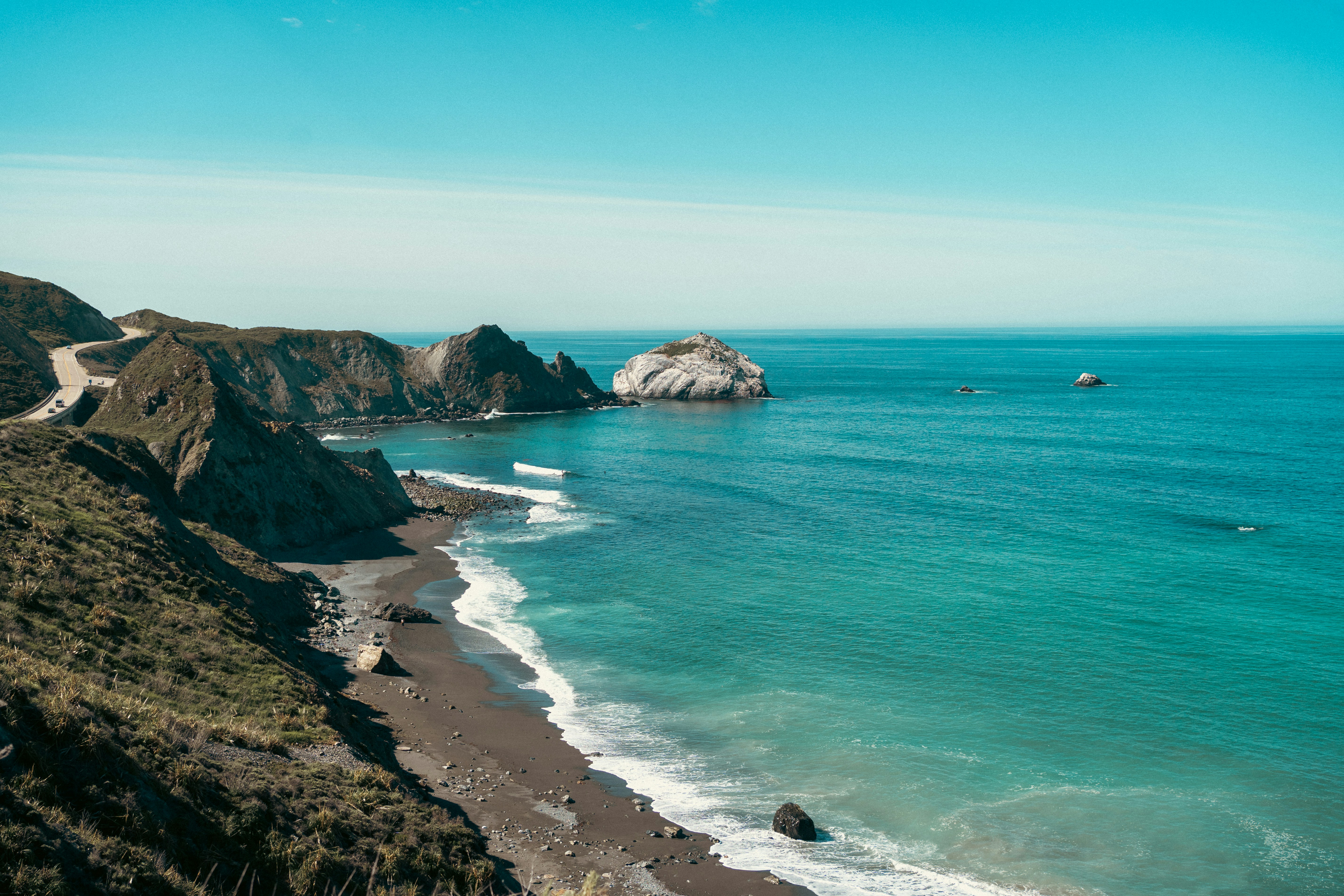 Coastal Ribbon: A Quiet Cliffside Panorama Over Turquoise Waters