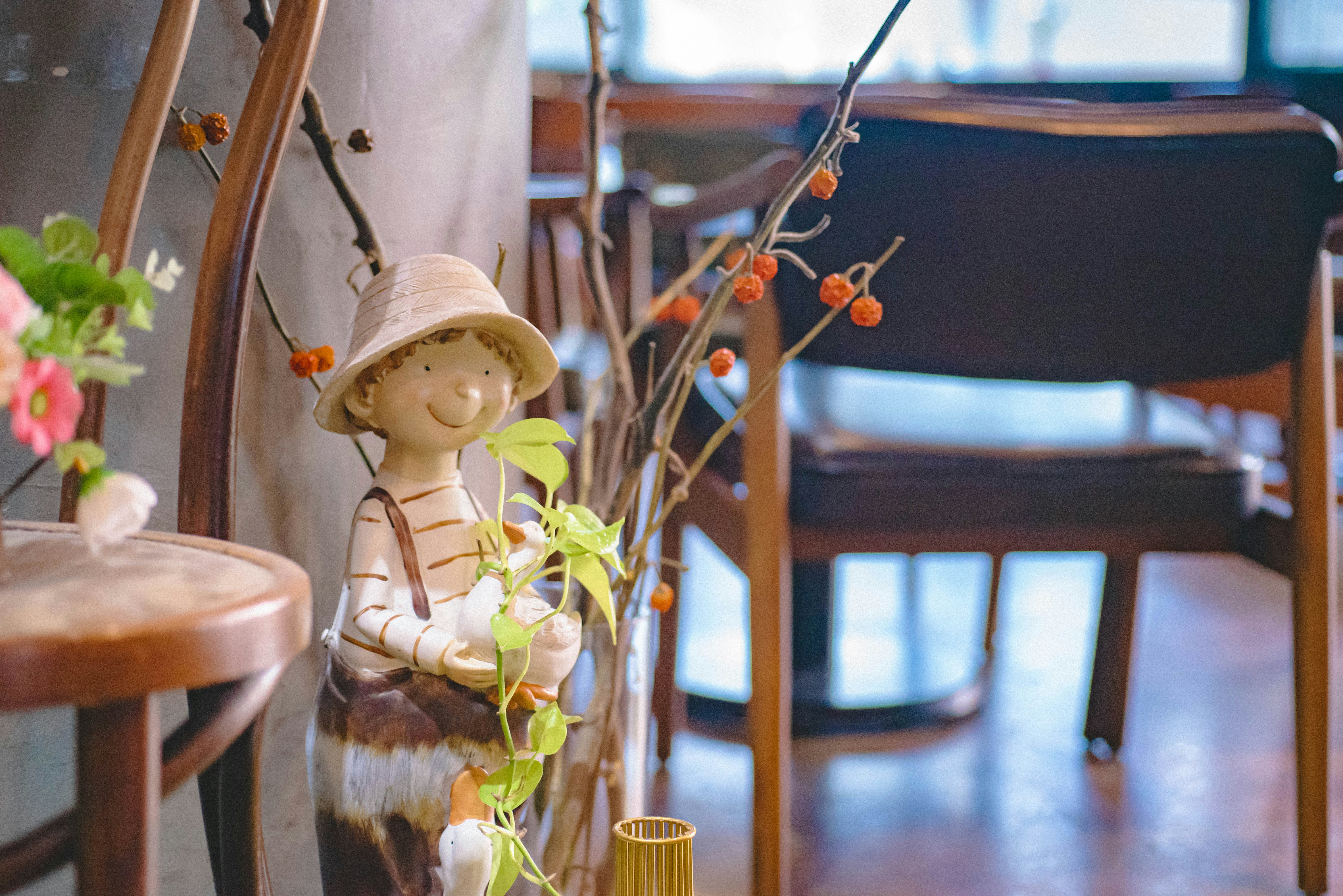 Whimsical Garden Statue among Indoor Studio Chair Chorus