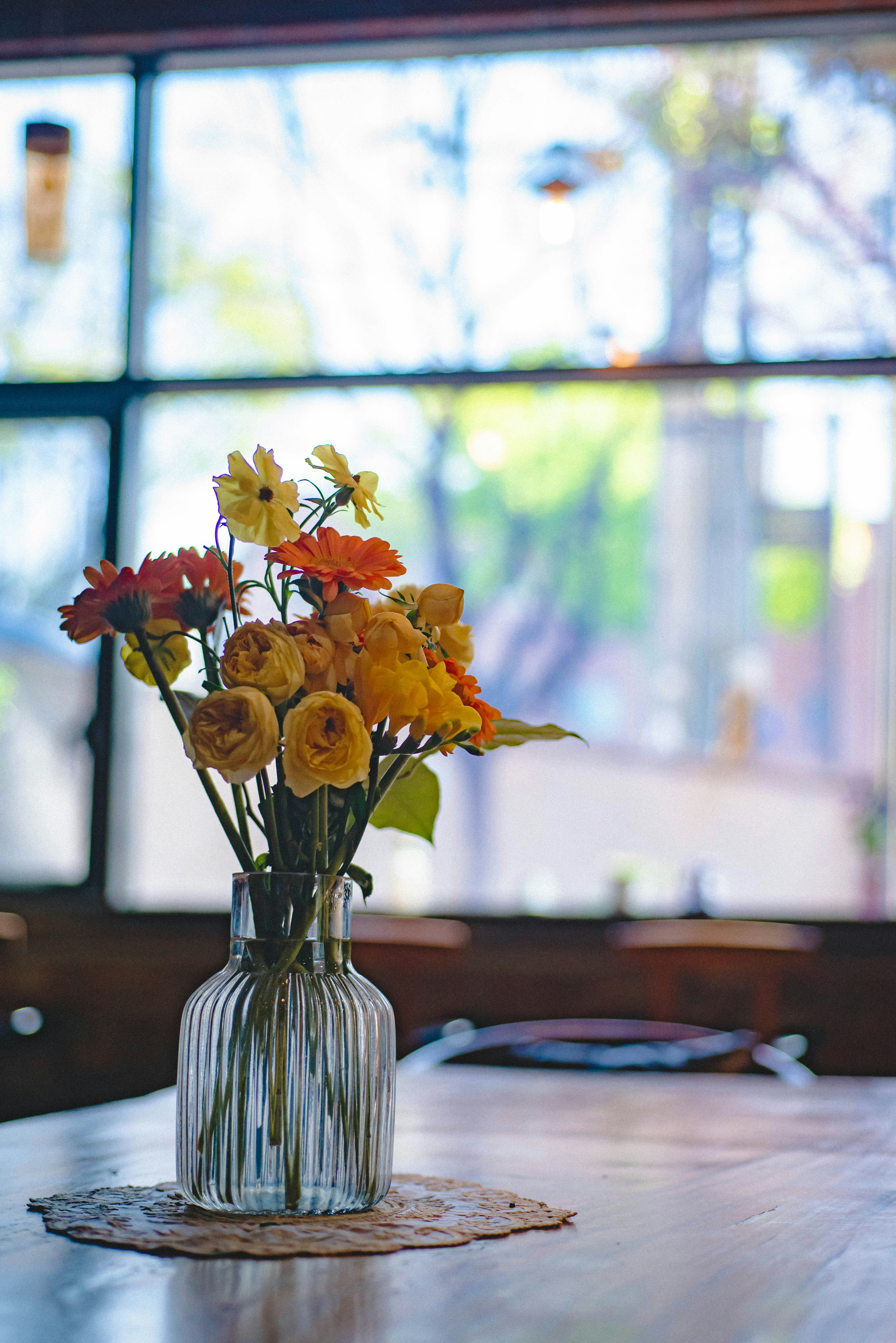 Vivid bouquet in a glass vase under soft window light