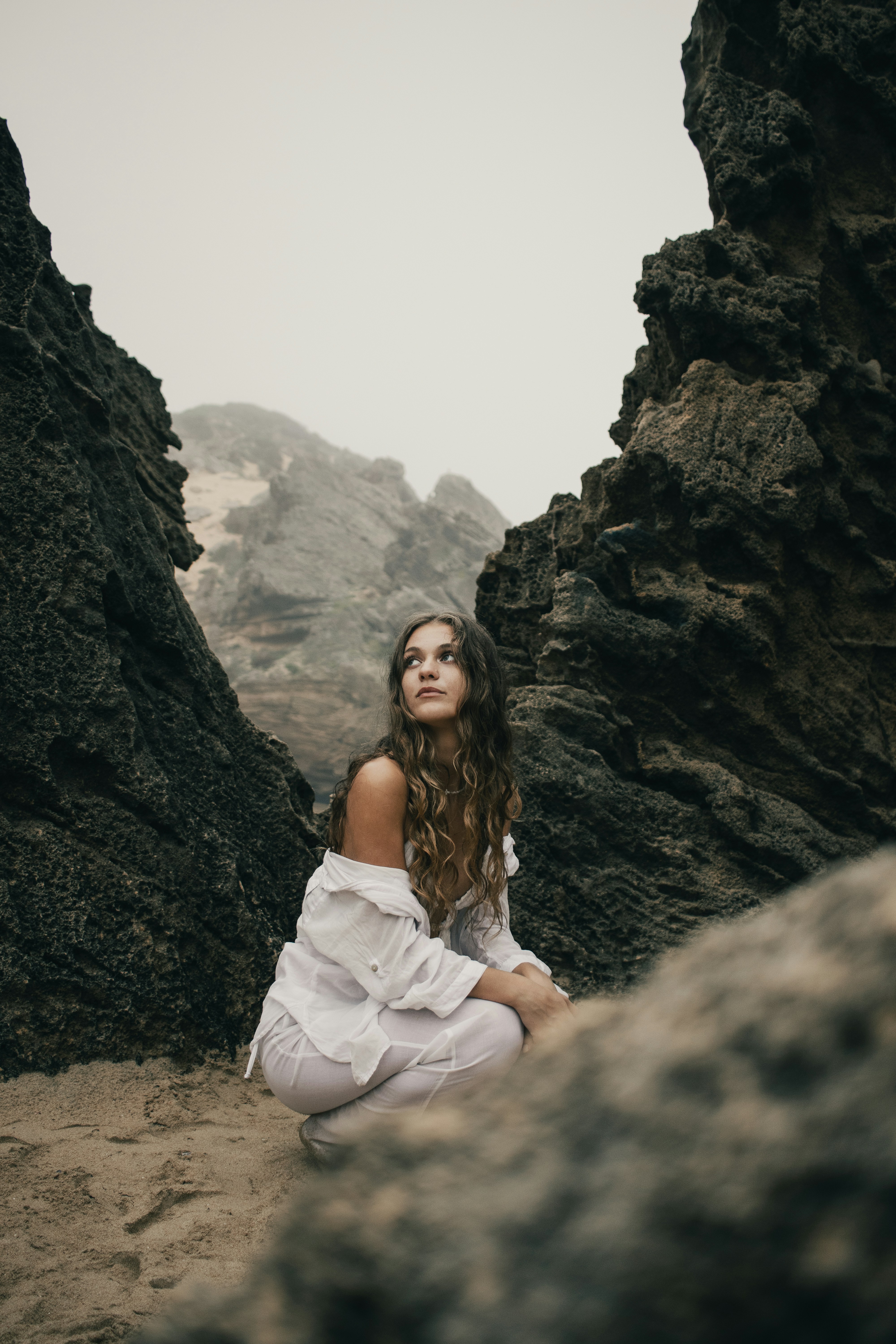 Among towering basalt: a quiet portrait between rugged cliffs