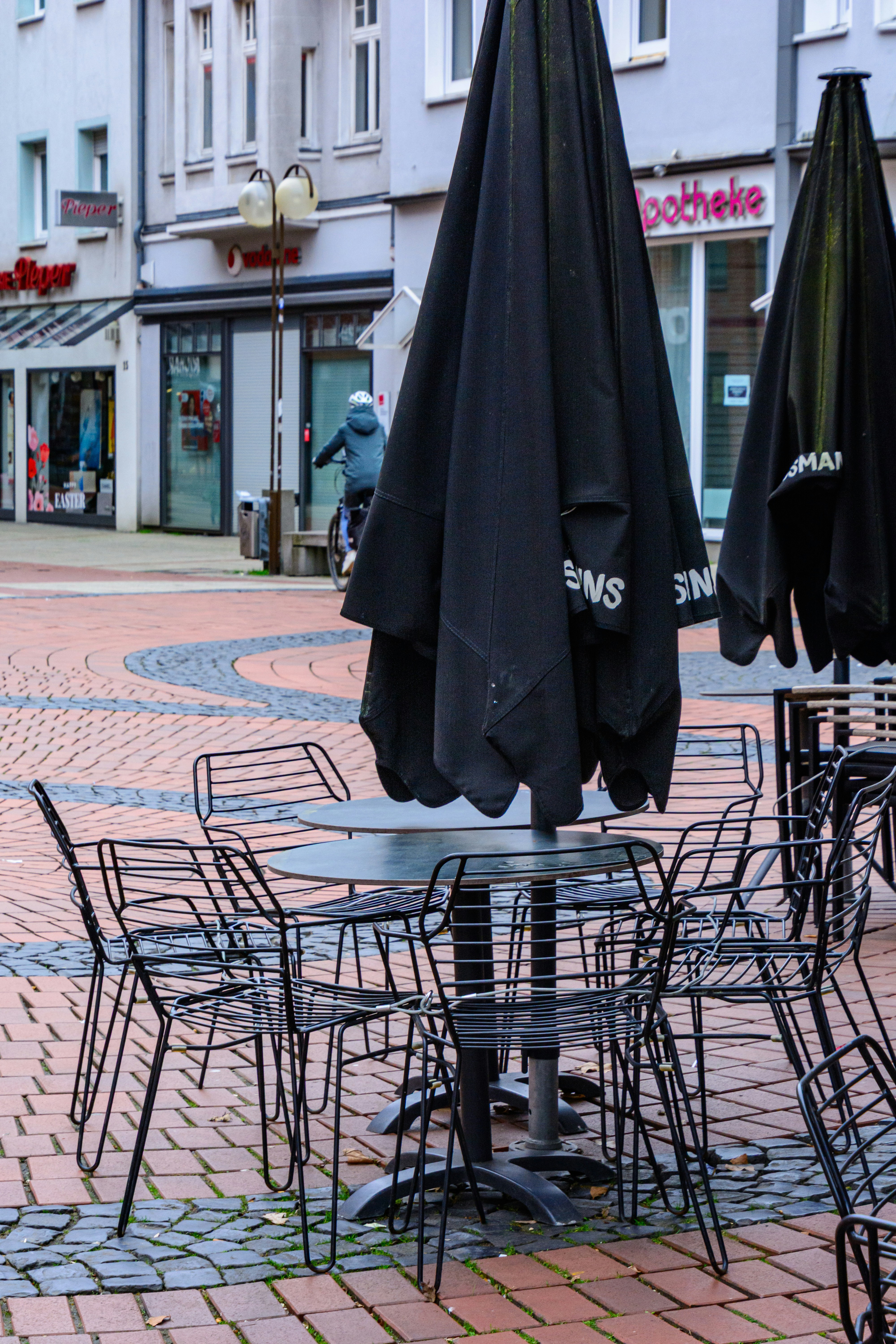 Cobbled Square and Quiet Café Veil