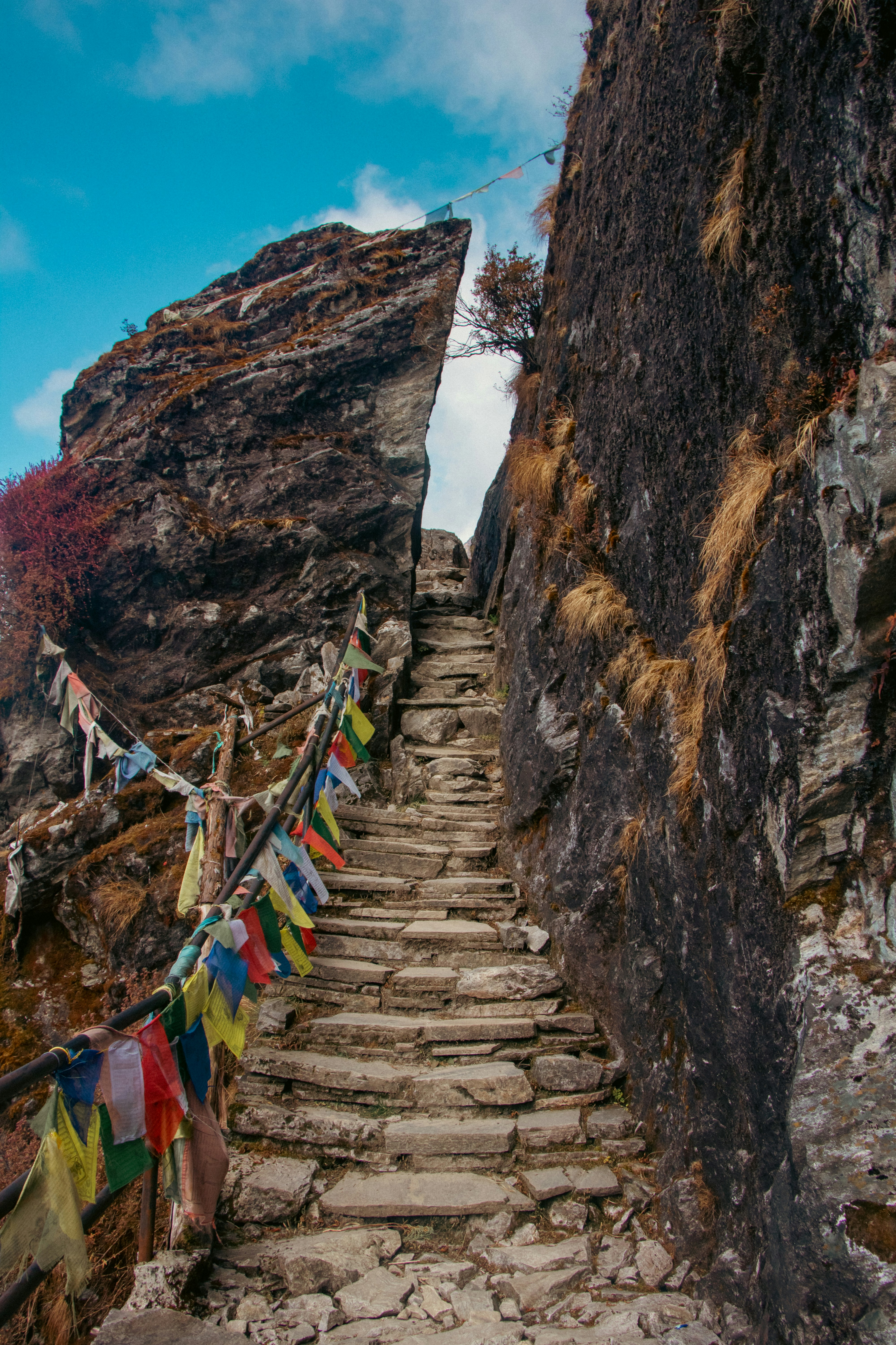Staircase Between Monolithic Cliffs: Prayer Flags Guiding the Ascent
