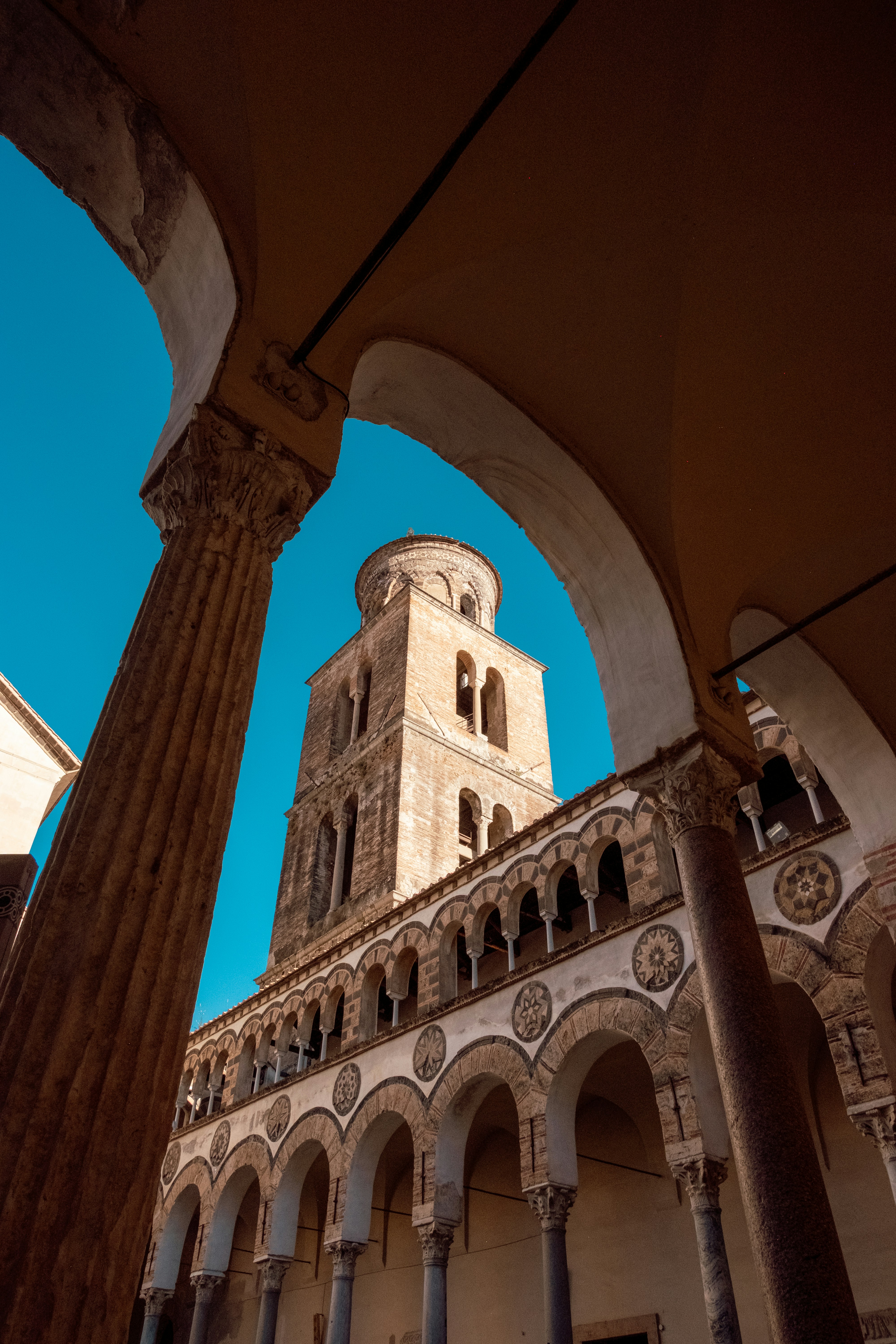 Cruciform Cloister: A Tower Crowned by Blue Sky