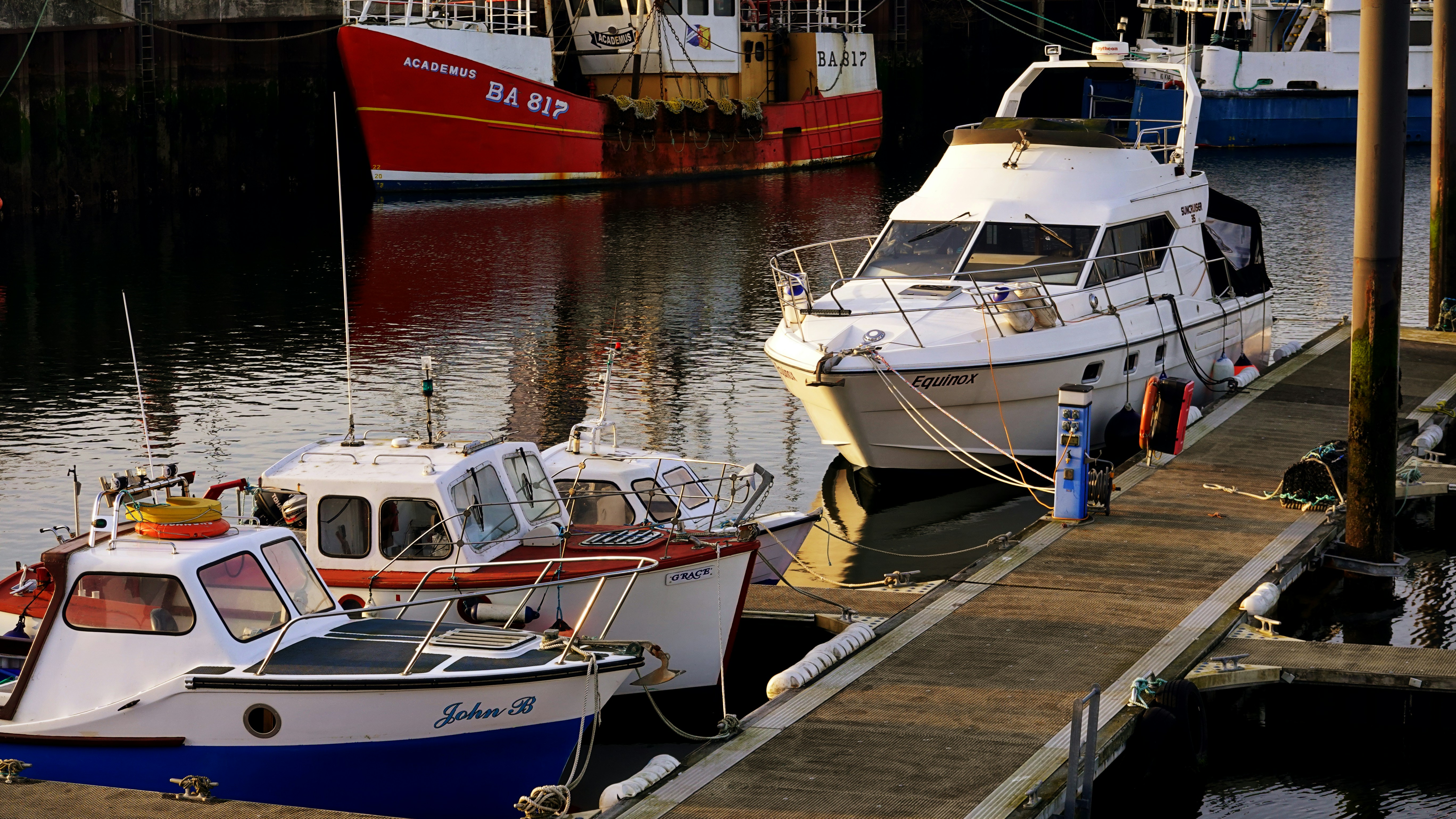 Dockside Lines: Boats Rest Between Slender Piers