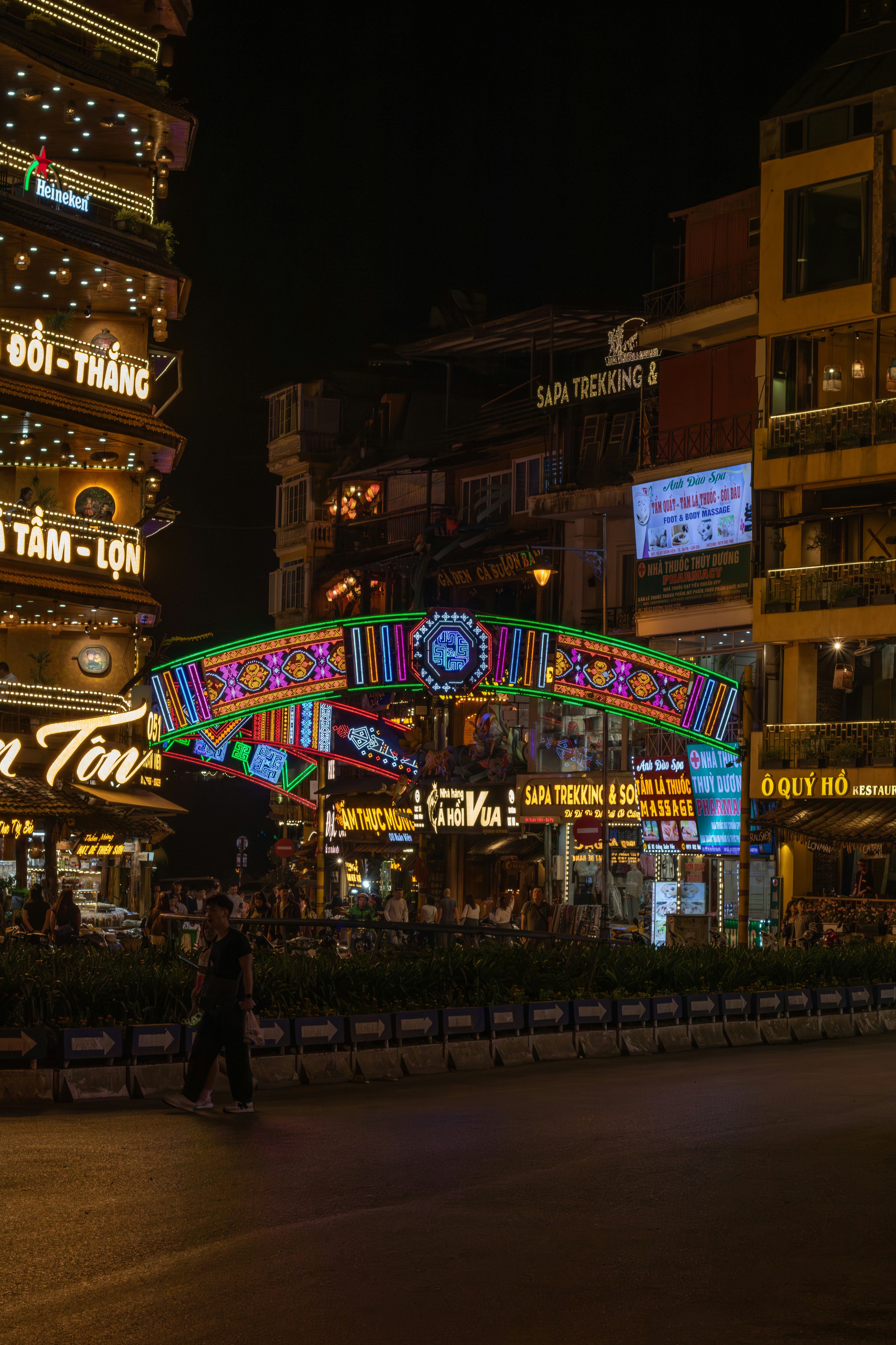 Neon Archway at Night: A lively street scene framed by glow