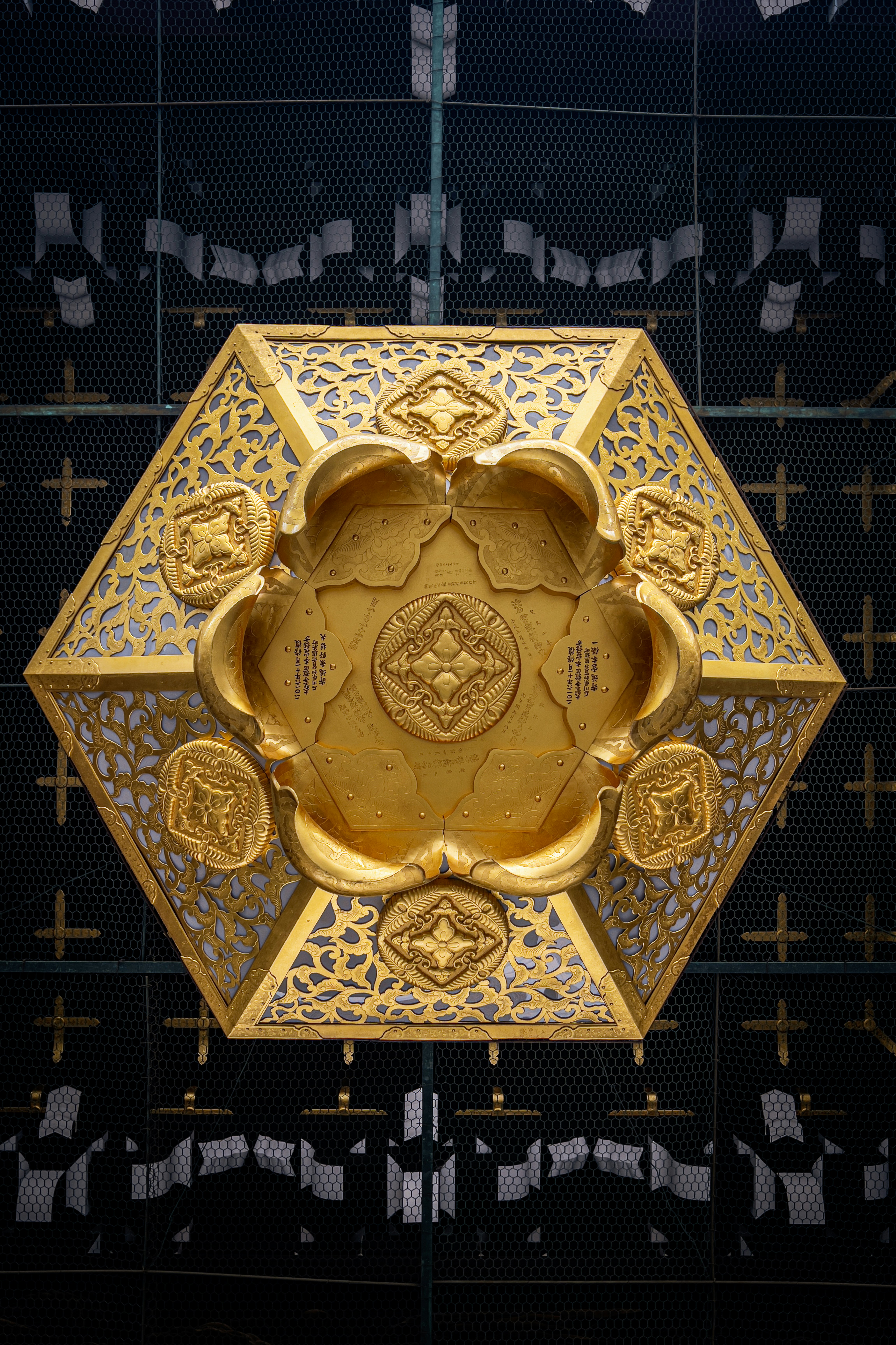 Ornate Golden Hexagon: A Central Medallion Surrounded by Dark Geometric Facade