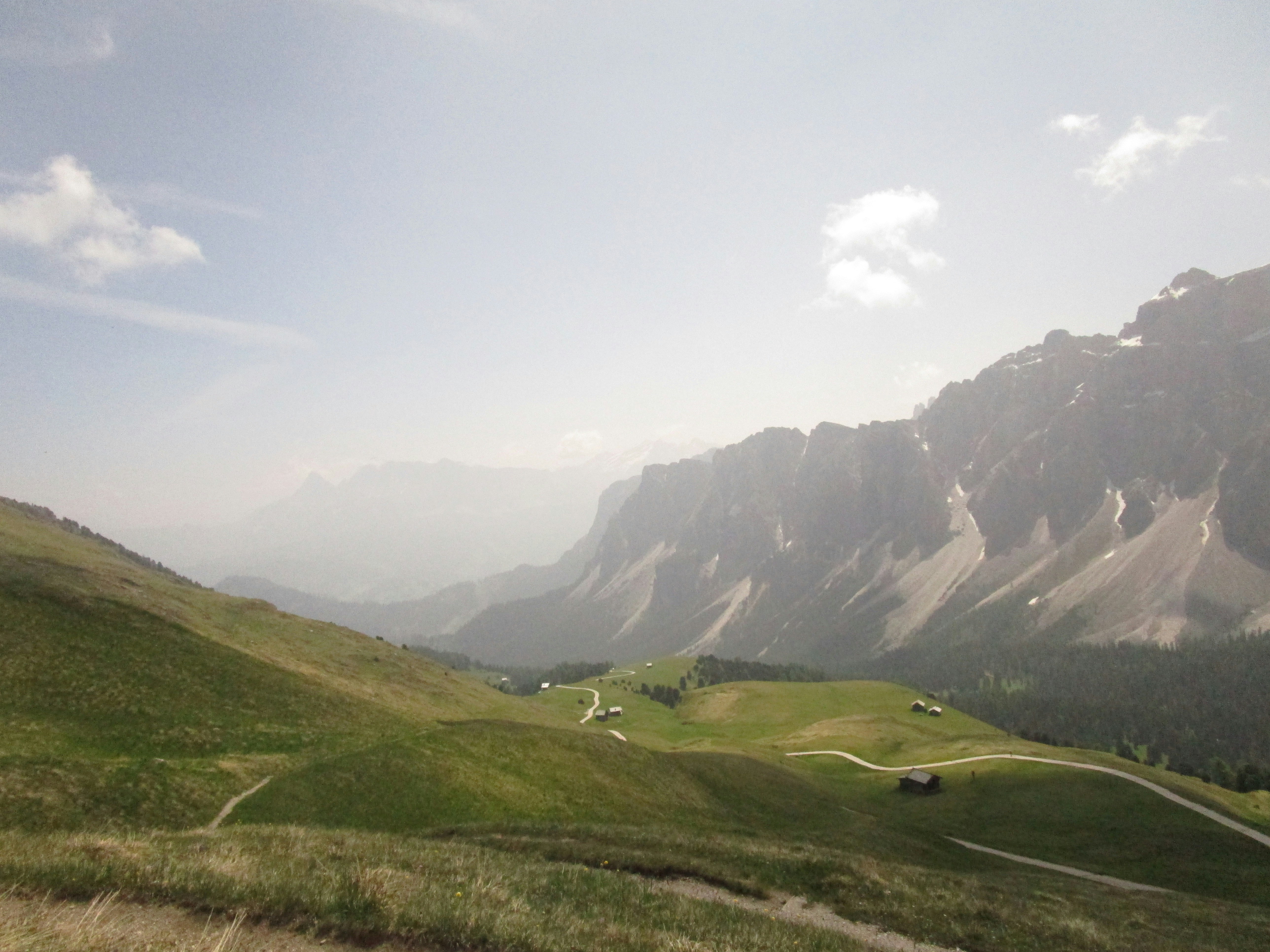 Rolling Alpine Valleys under a Quiet Sky