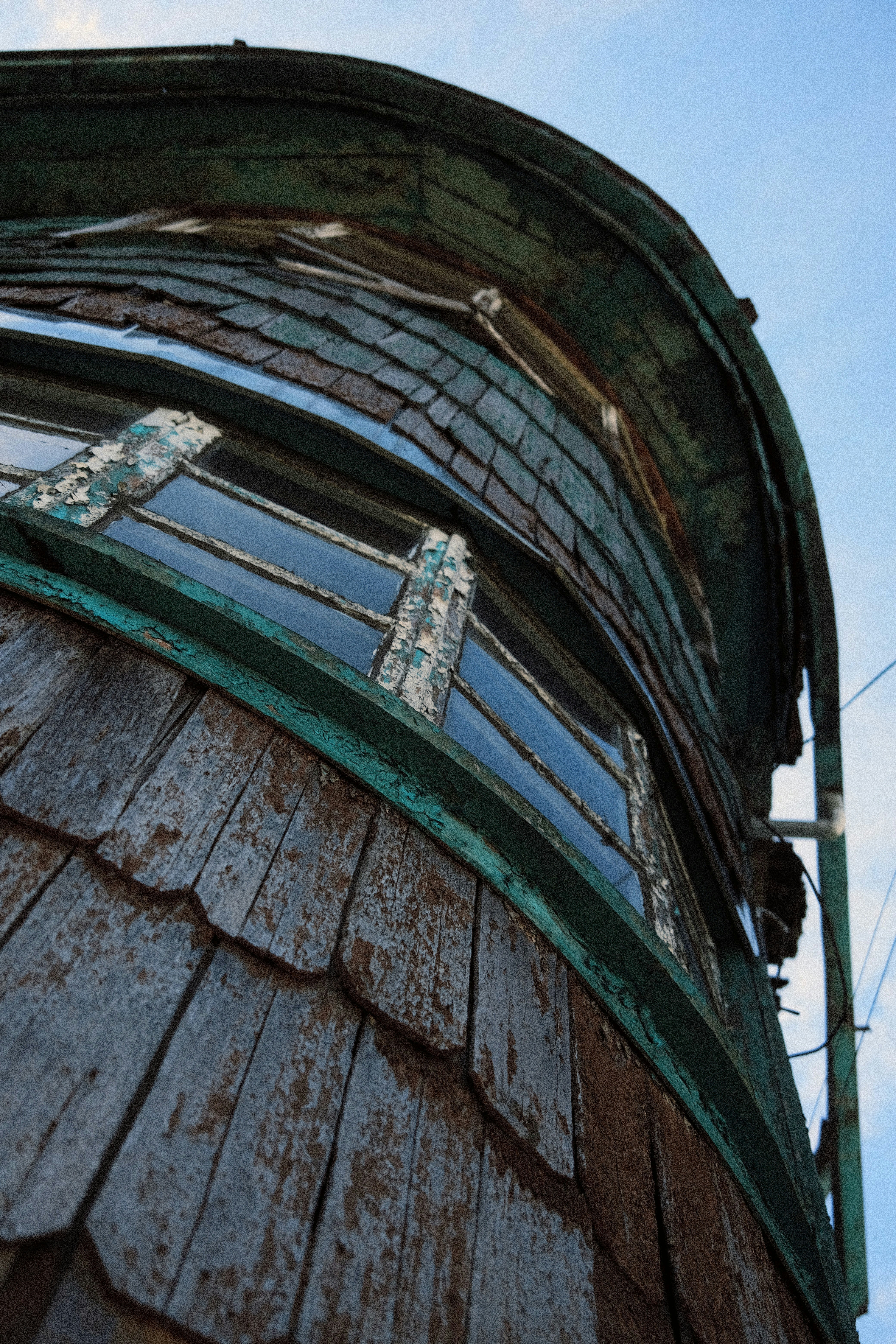 Weathered Circular Turret: Curved Shingle Wall with Green Trim