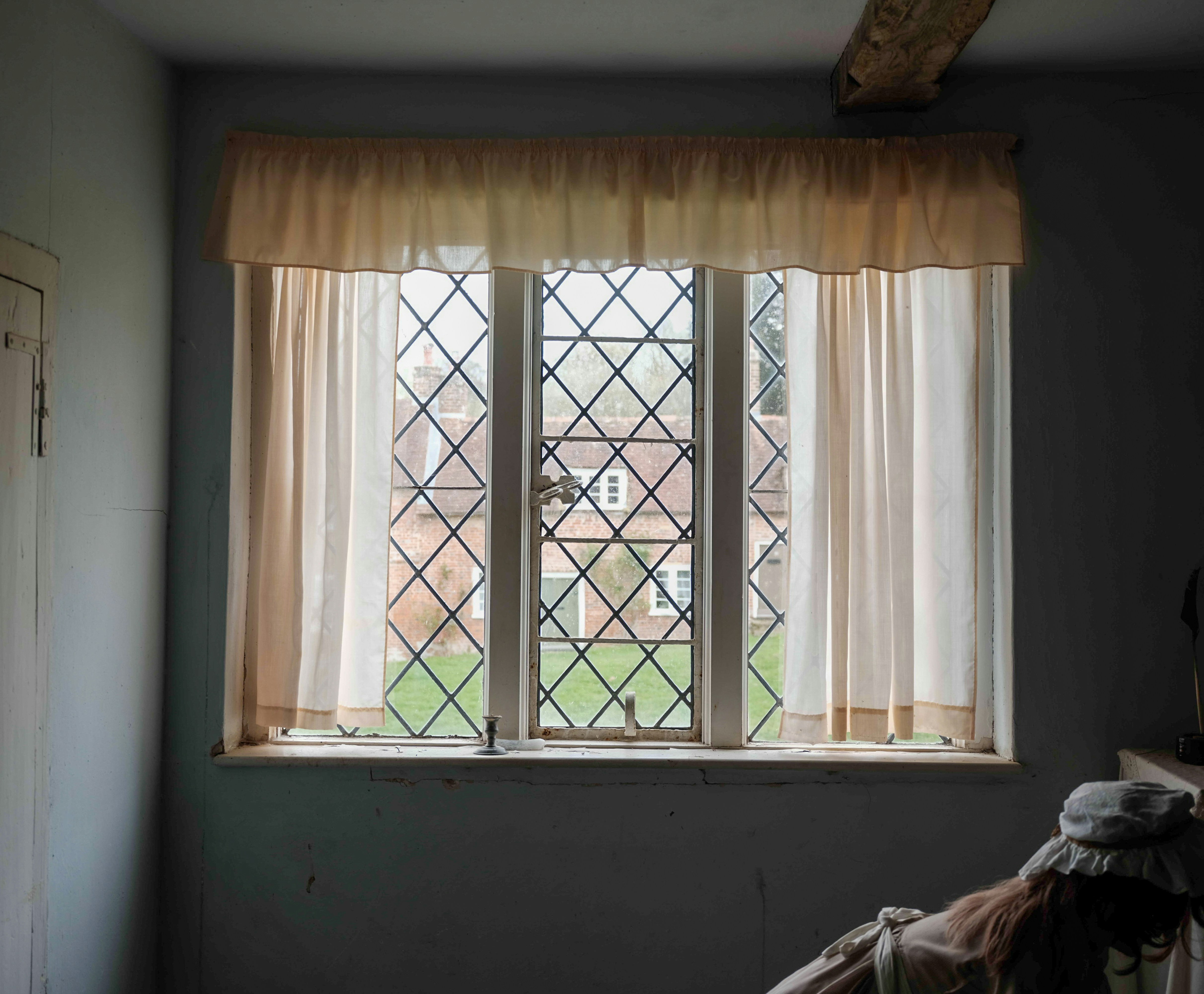Windowed Light through Diamond Grille: A Quiet Interior Moment