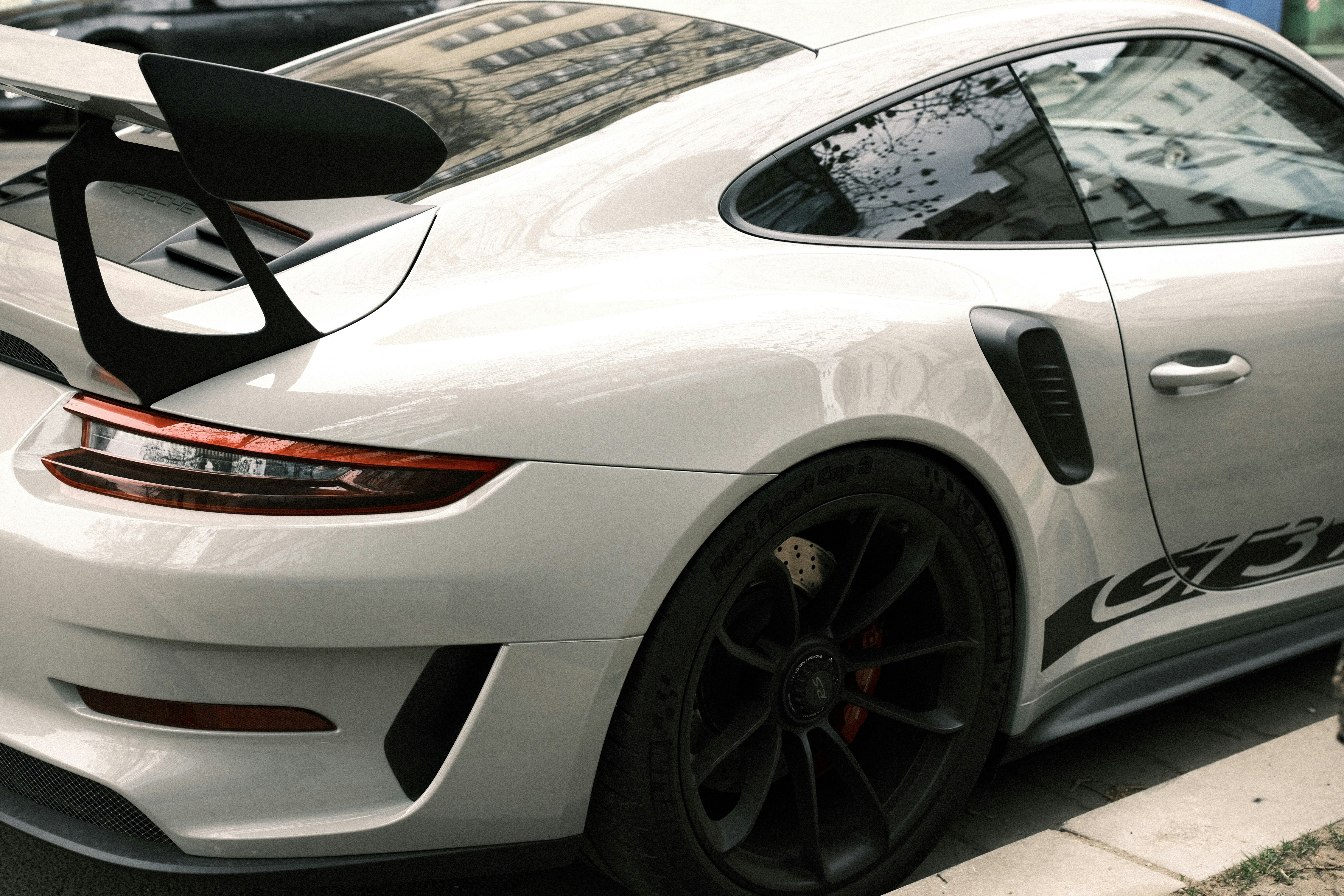 White Porsche GT3 RS Wing, Side Sill and Wheel in Focus