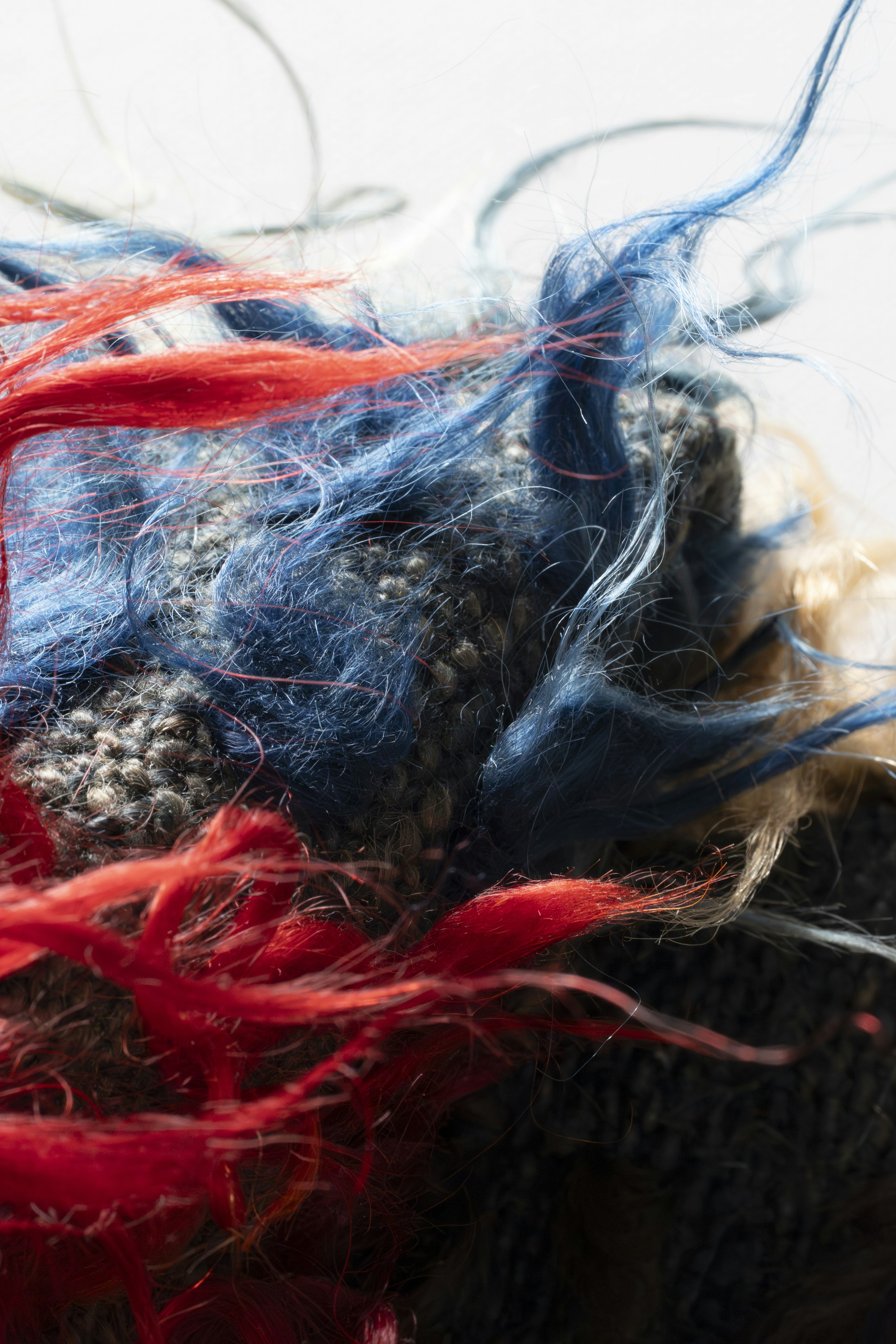 Tangled Strands: A Macro Portrait of Colorful Fibers