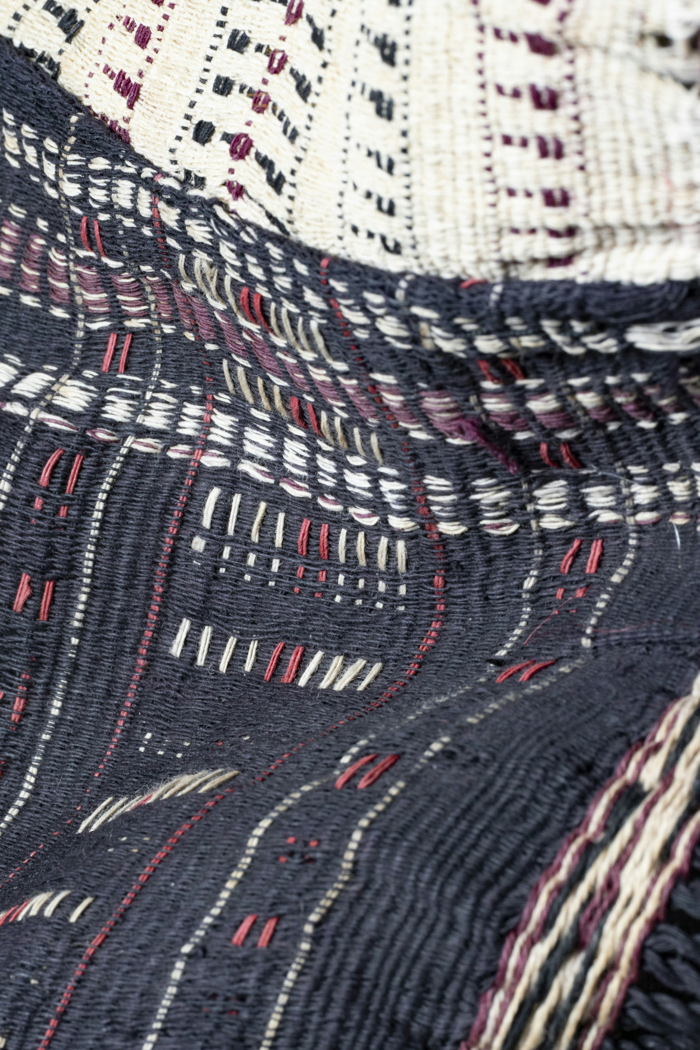 Weave of Color: Textile Strata Across Dark and Light Threads