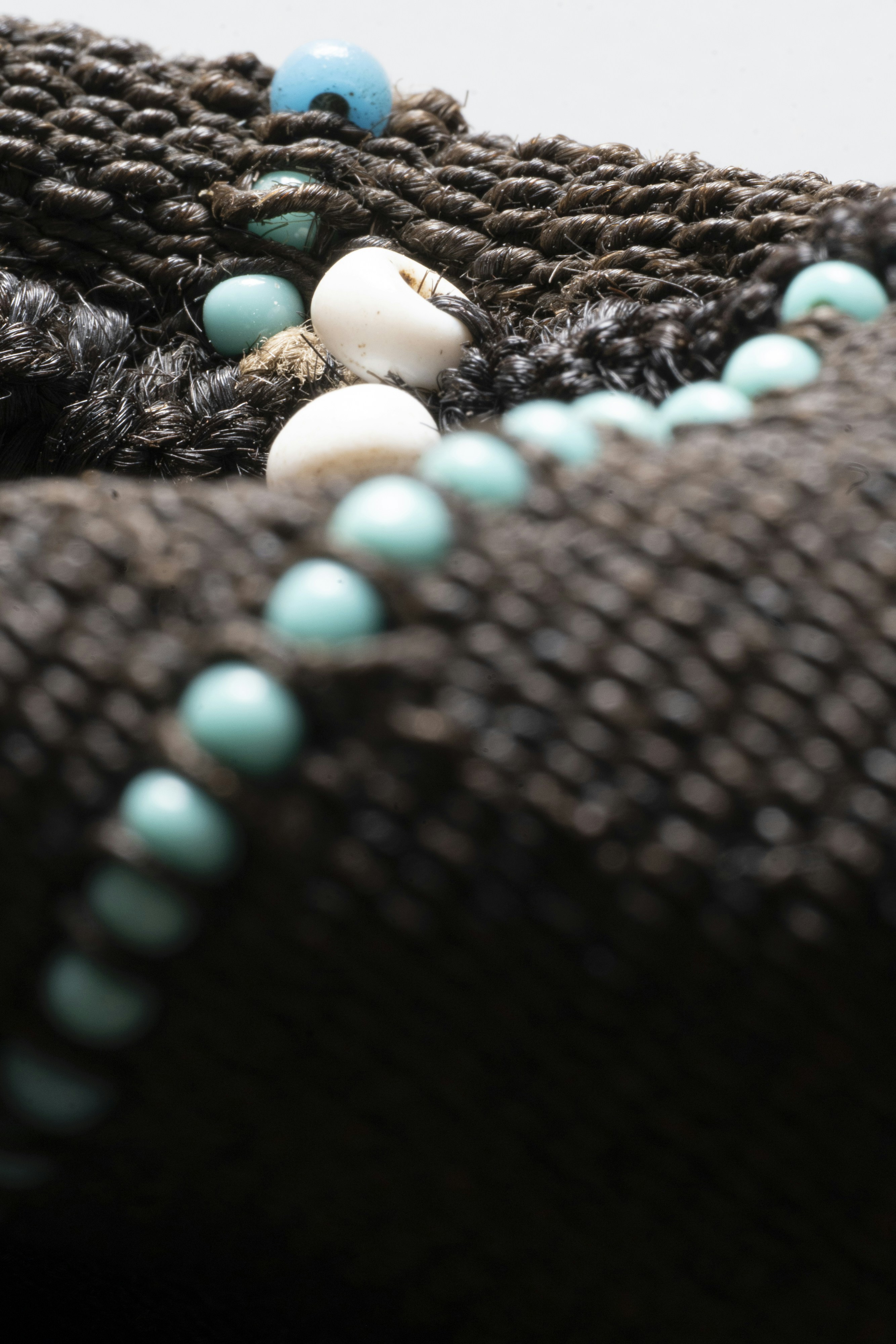Beaded Threadwork: A Close-up on Texture and Turquoise Orbs