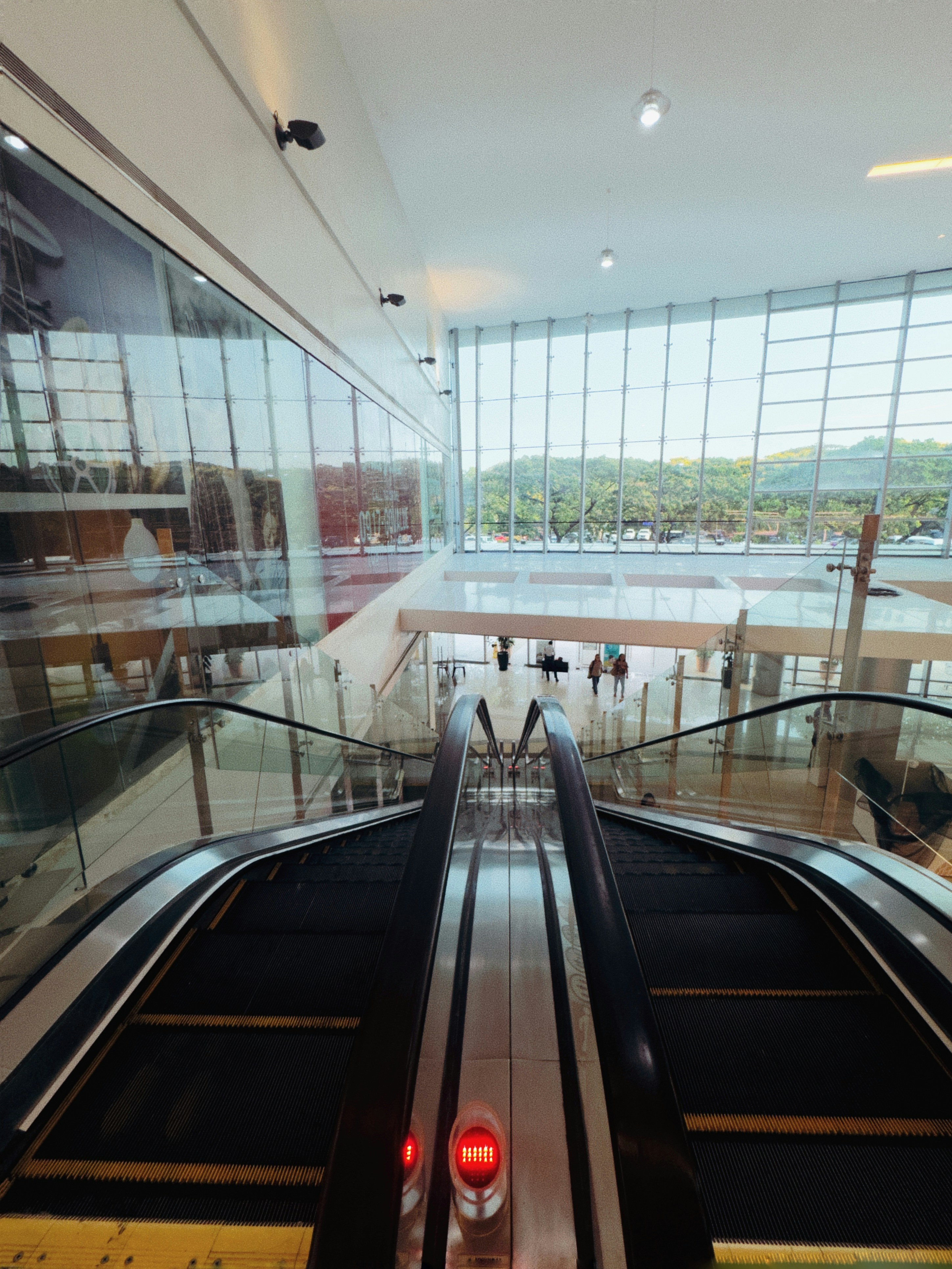 Escalator to the Glass Atrium: Morning Light Over a Modern Mall