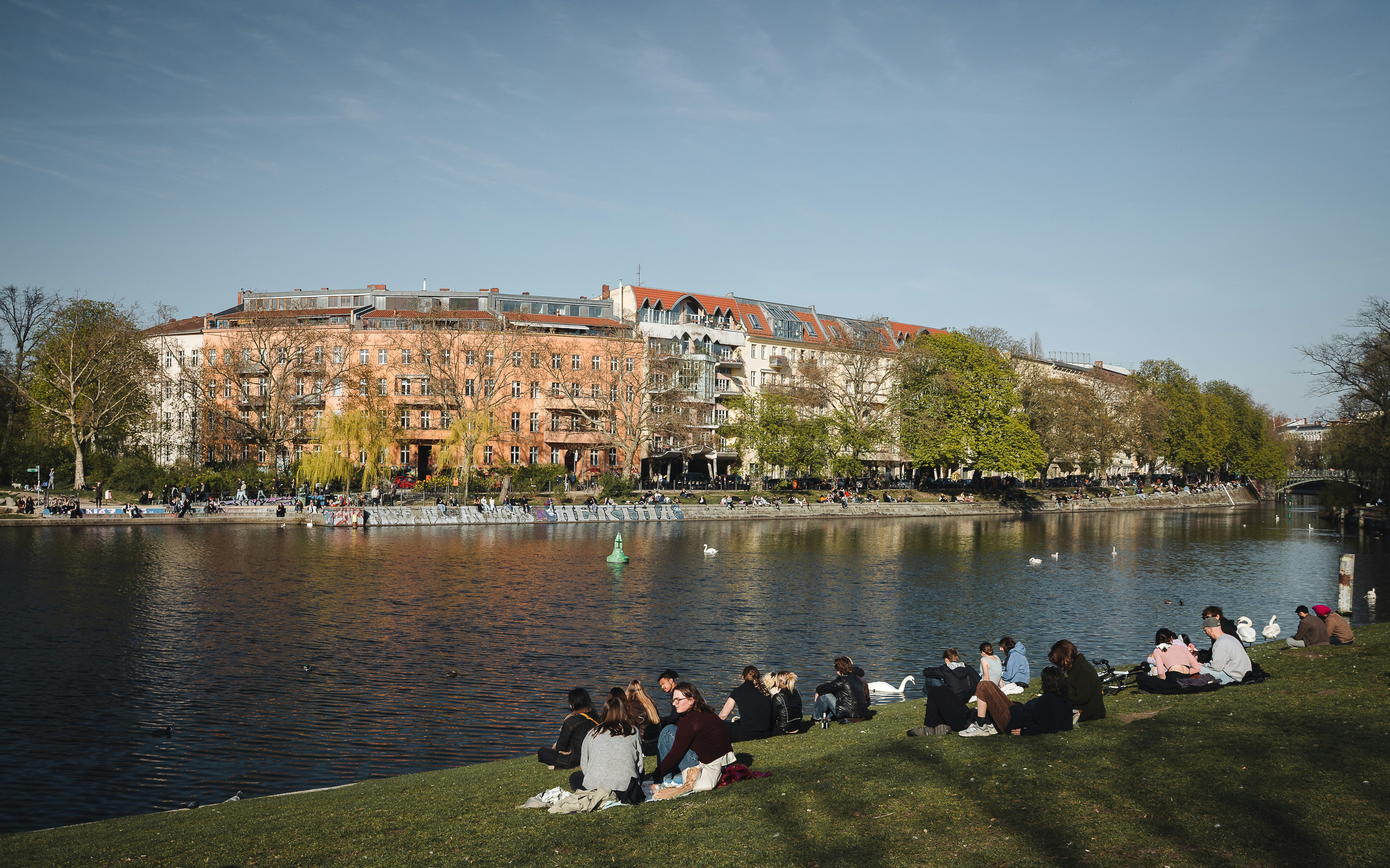 Riverside Gatherings under a Bluesky Afternoon