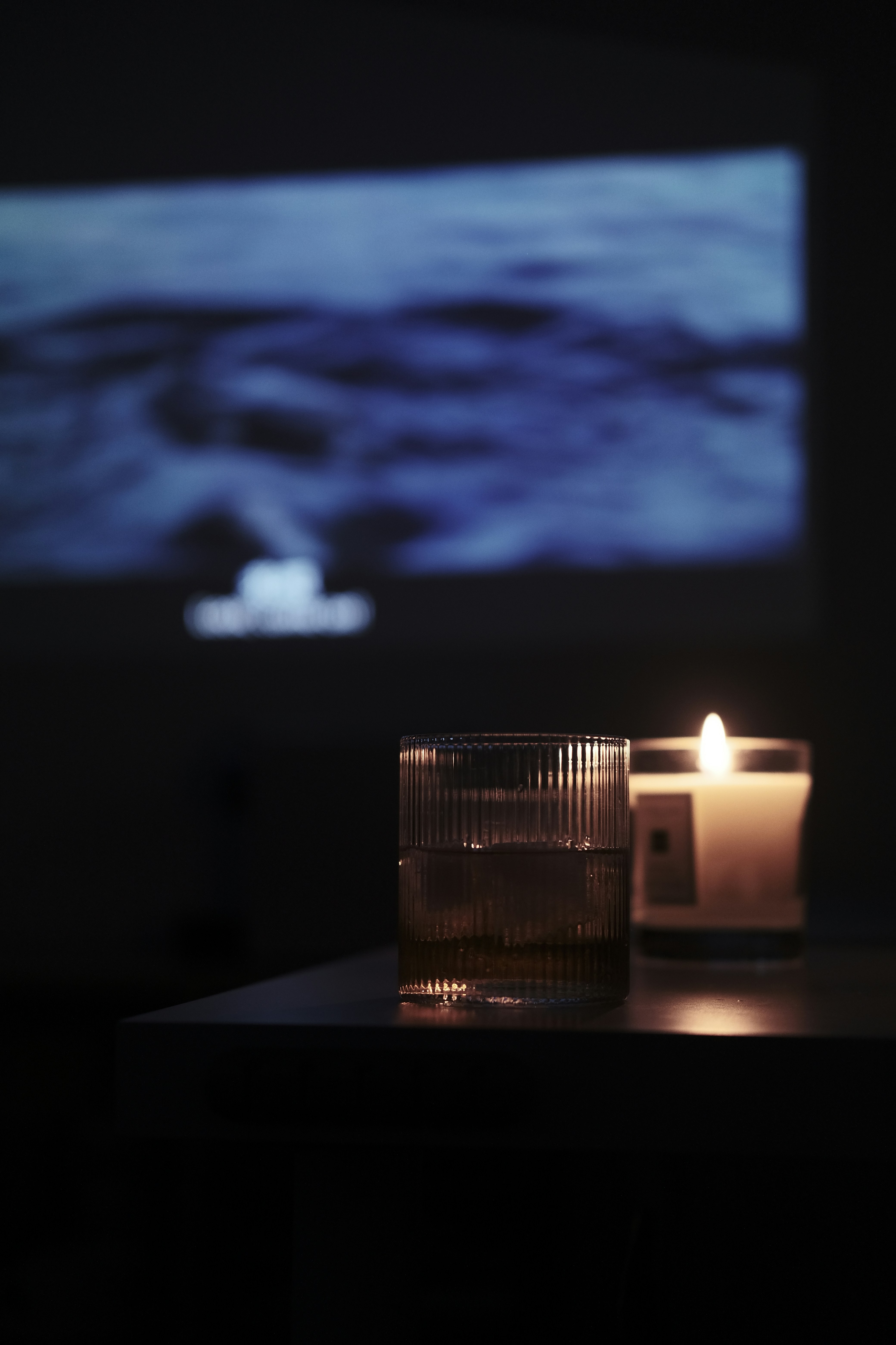 Quiet Gloaming: Candlelight and Projection in a Dim Lounge