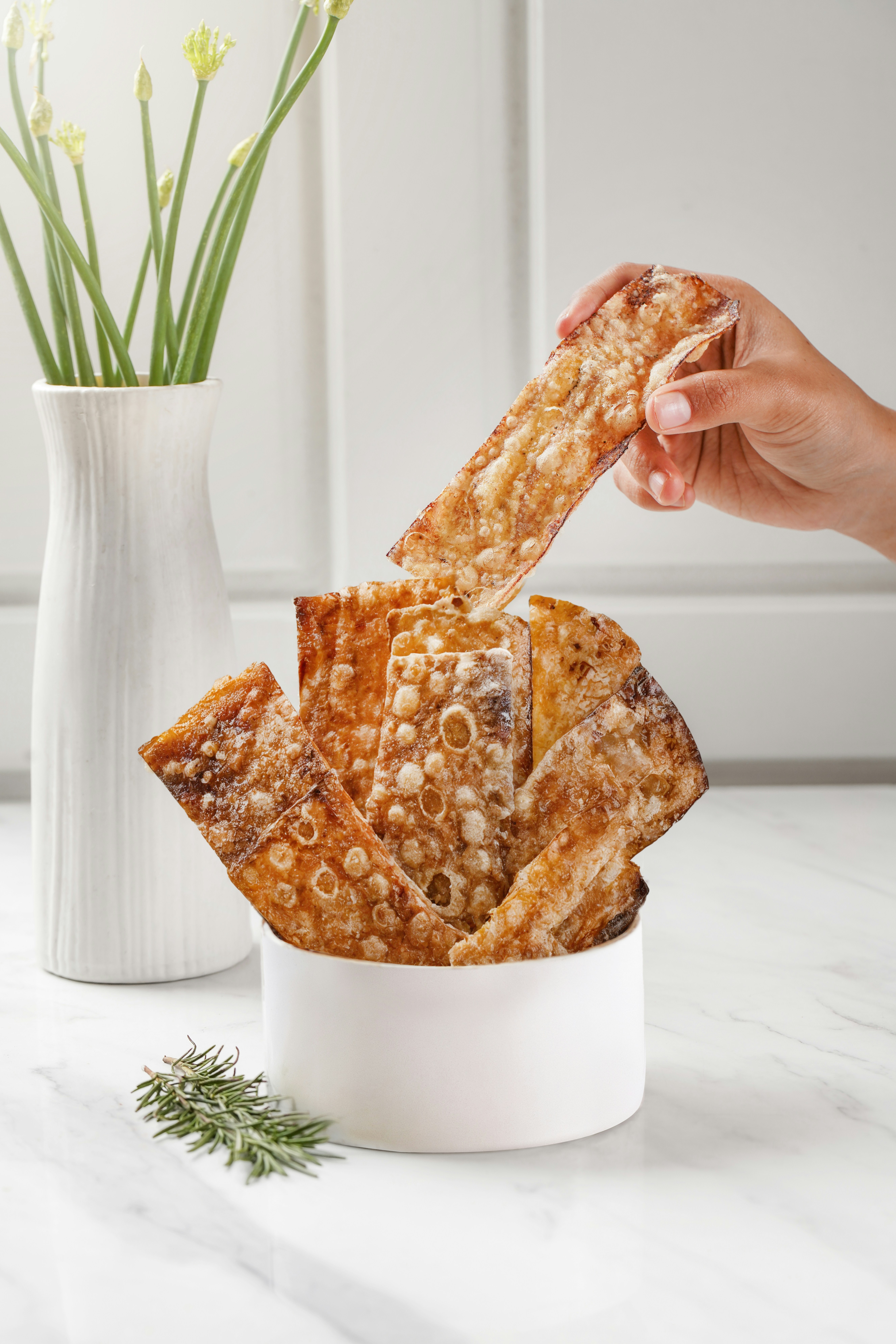 Crispy-Treaded Bites: Hand Plucks a Towering Stack of Pan-Fried Bread