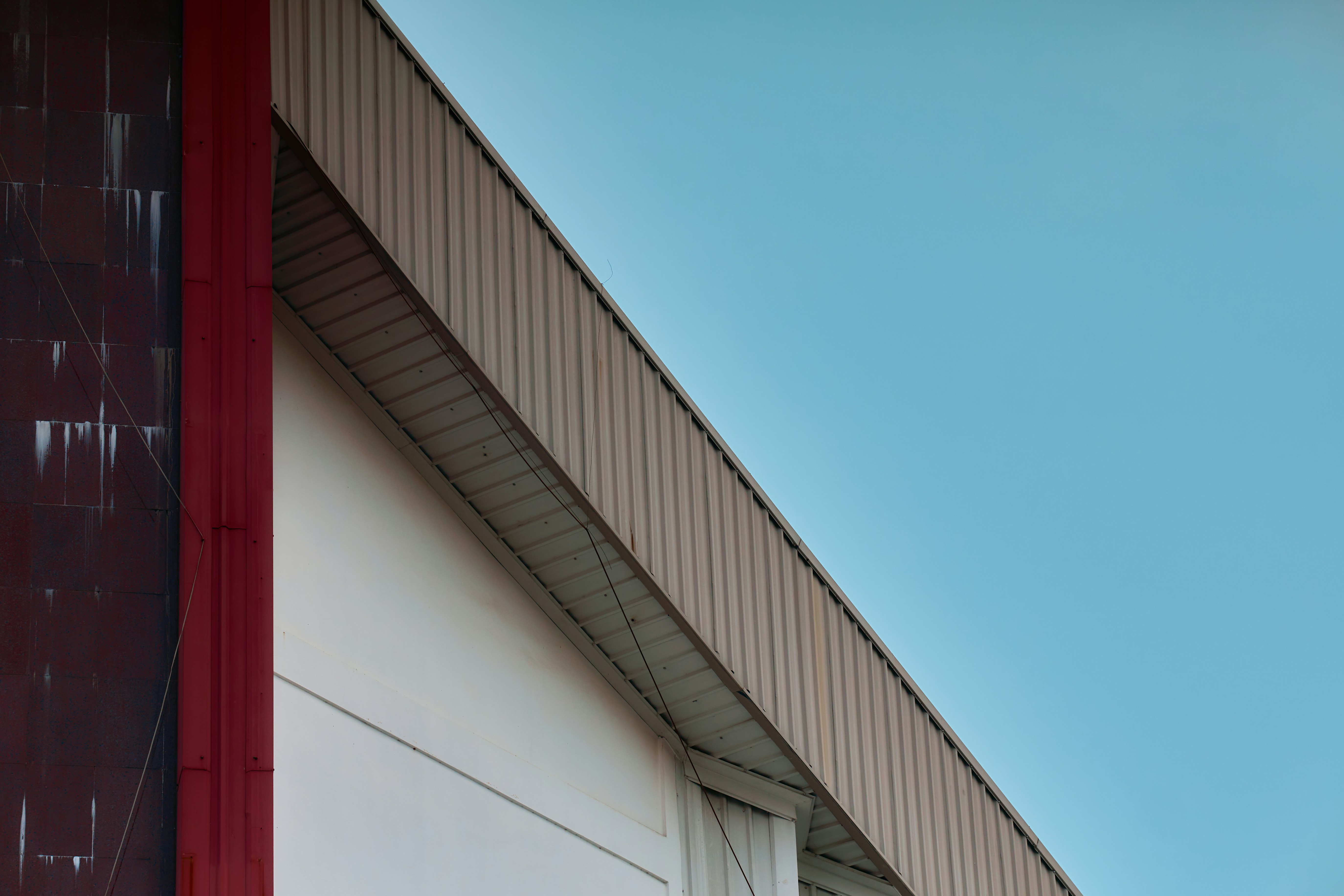 Architectural Edge: A Slate Roof Against Clear Sky