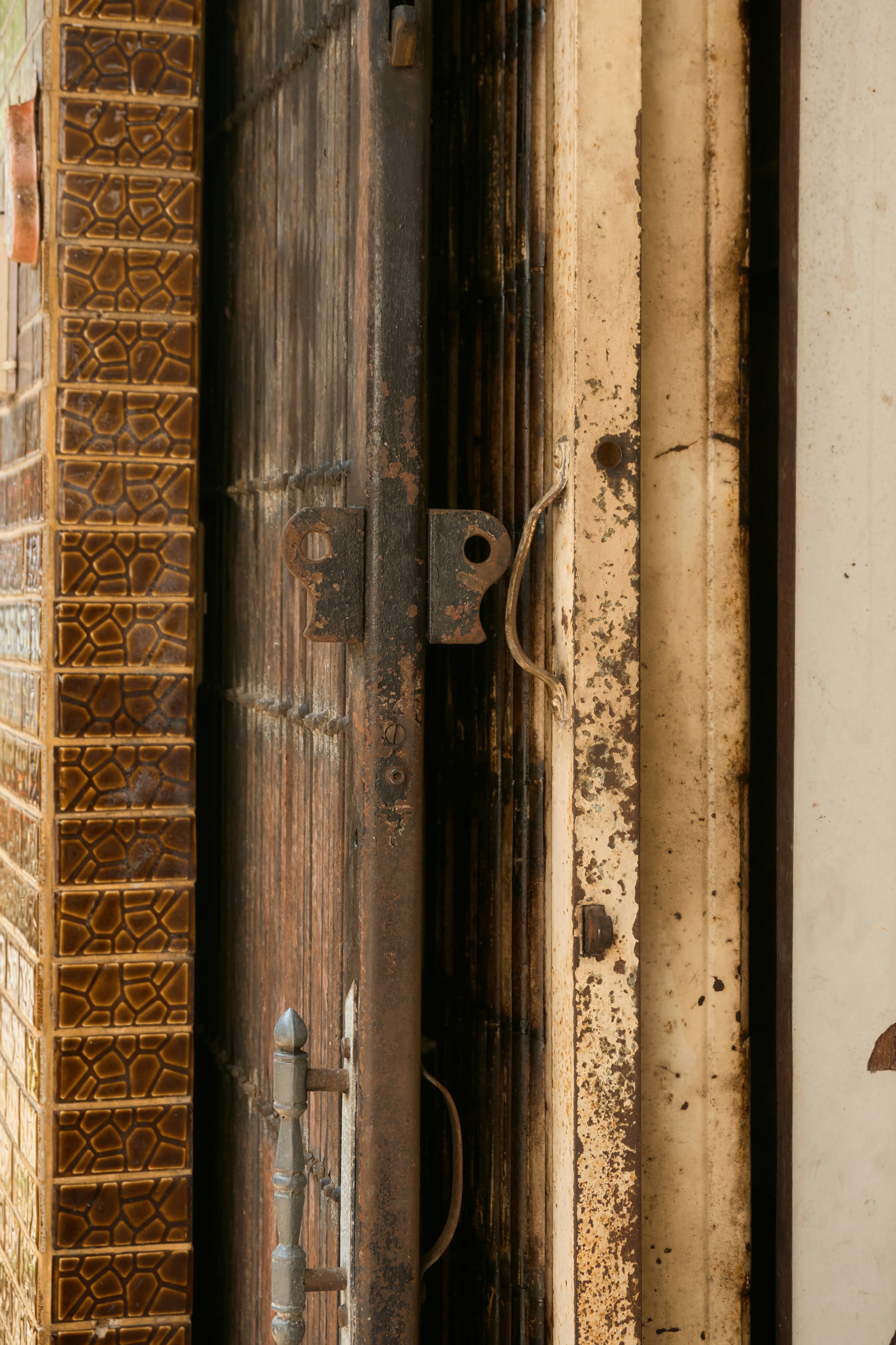 Rust and Routine: A Weathered Door Stop with Its Hidden Mechanisms