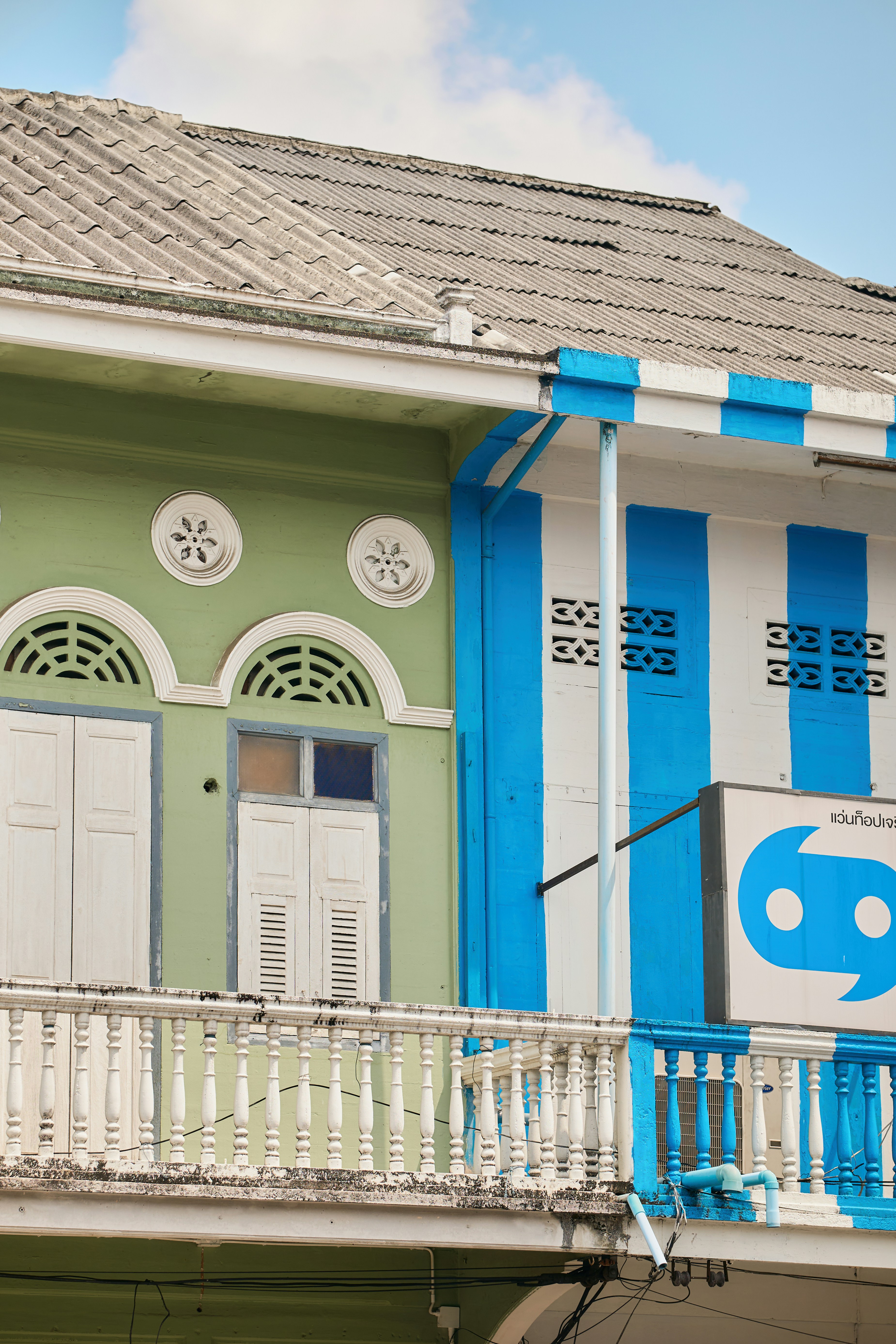 Colorful Colonial Facade with Blue and Green Accents