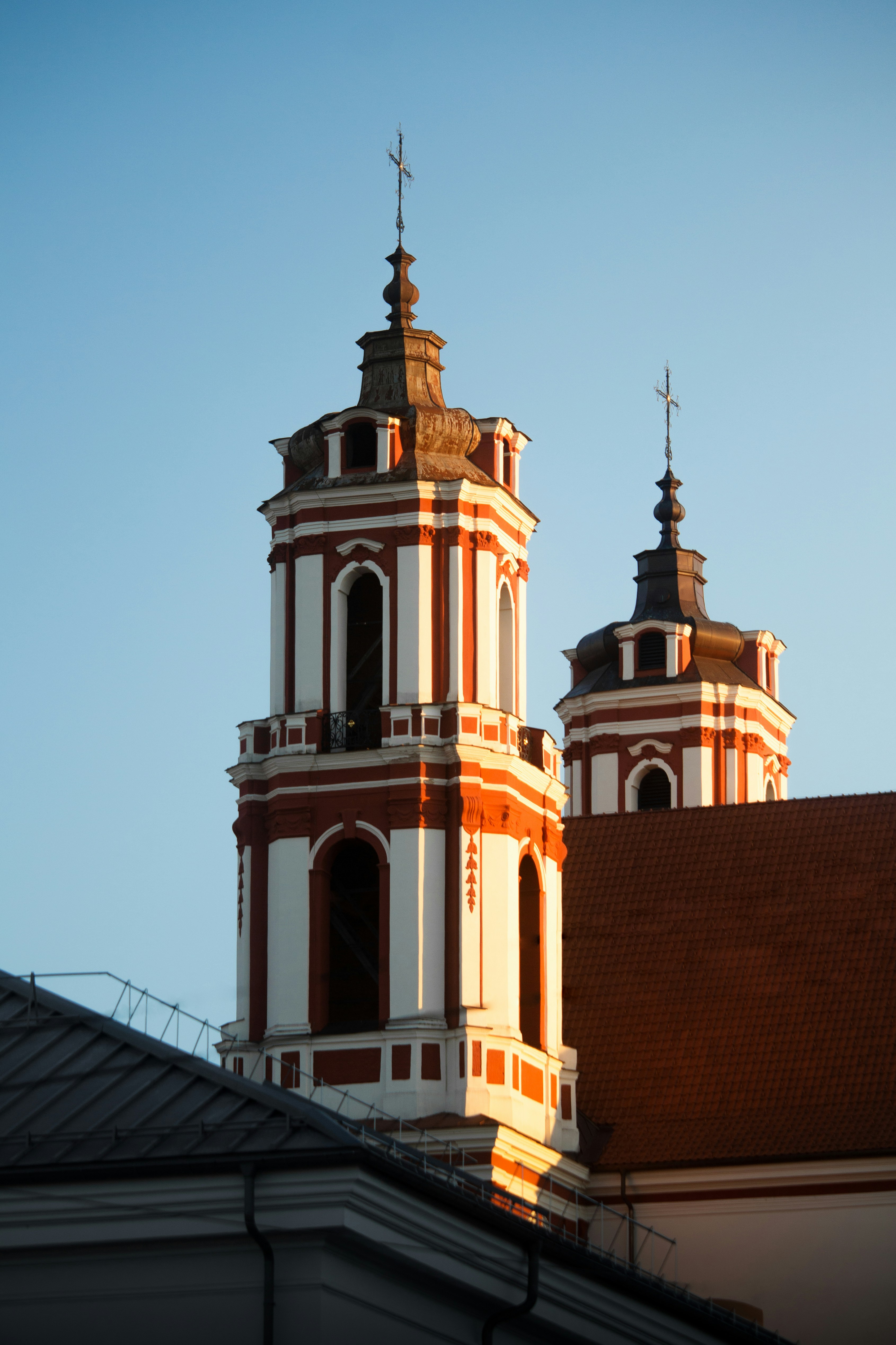 Sunlit Baroque Towers Piercing a Clear Blue Sky