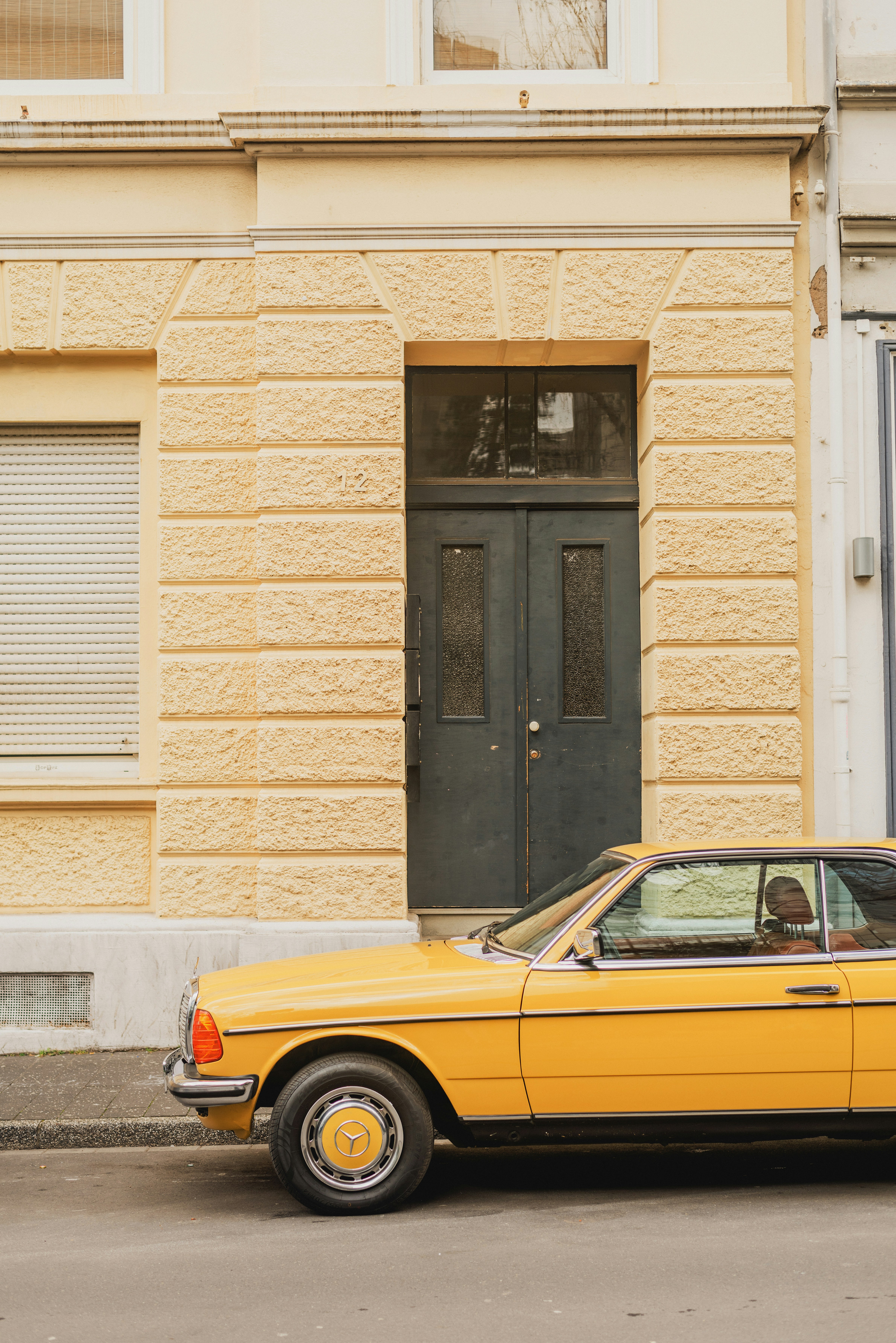 Yellow Vintage on a Quiet Cobblestone Street