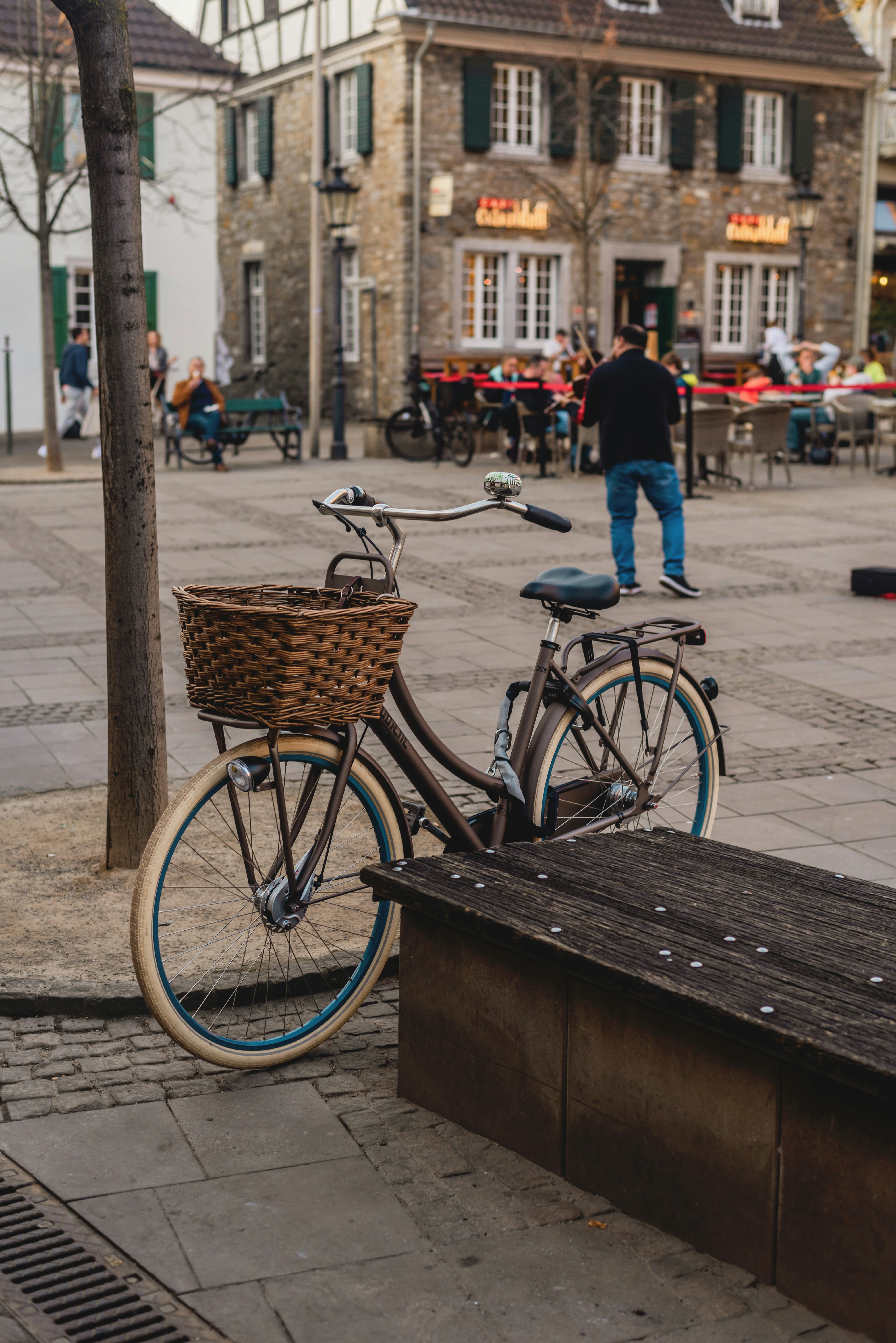 Bicycle in the Square: A Quiet Moment by the Café