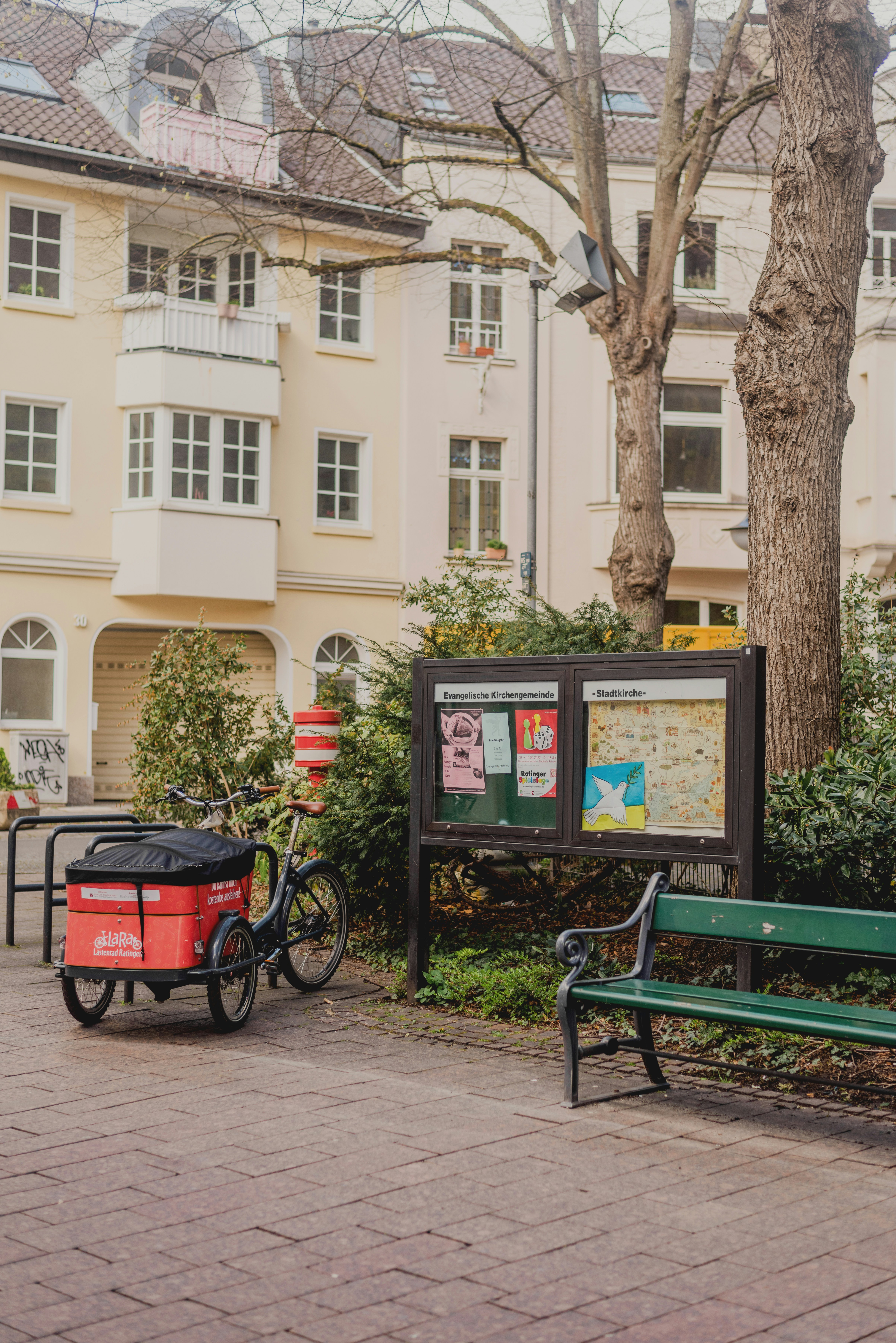 Street Corner with Bike and Bulletin Board in a Quiet European Square
