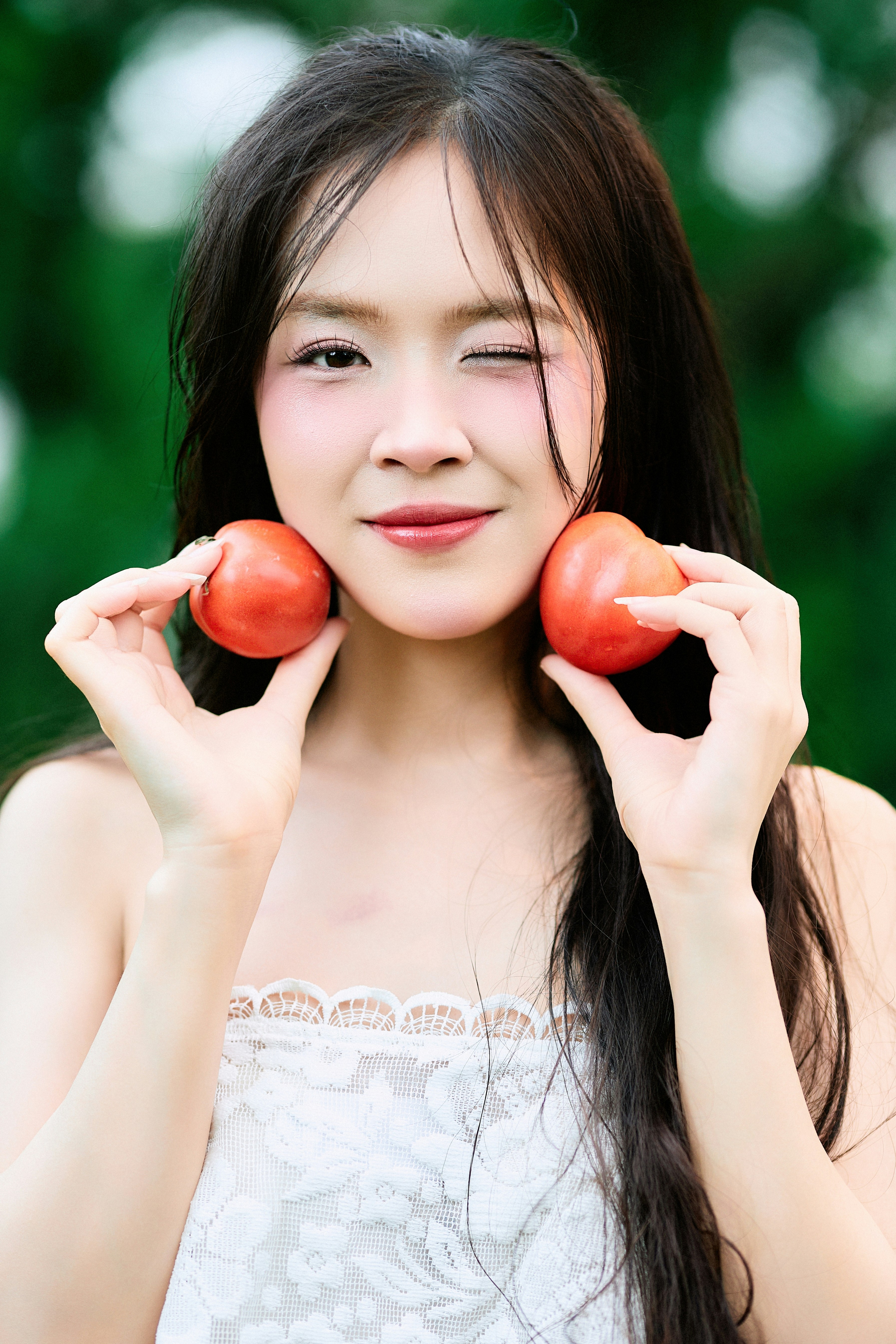 Cherry-cheeked Portrait: A playful wink with tomatoes as props
