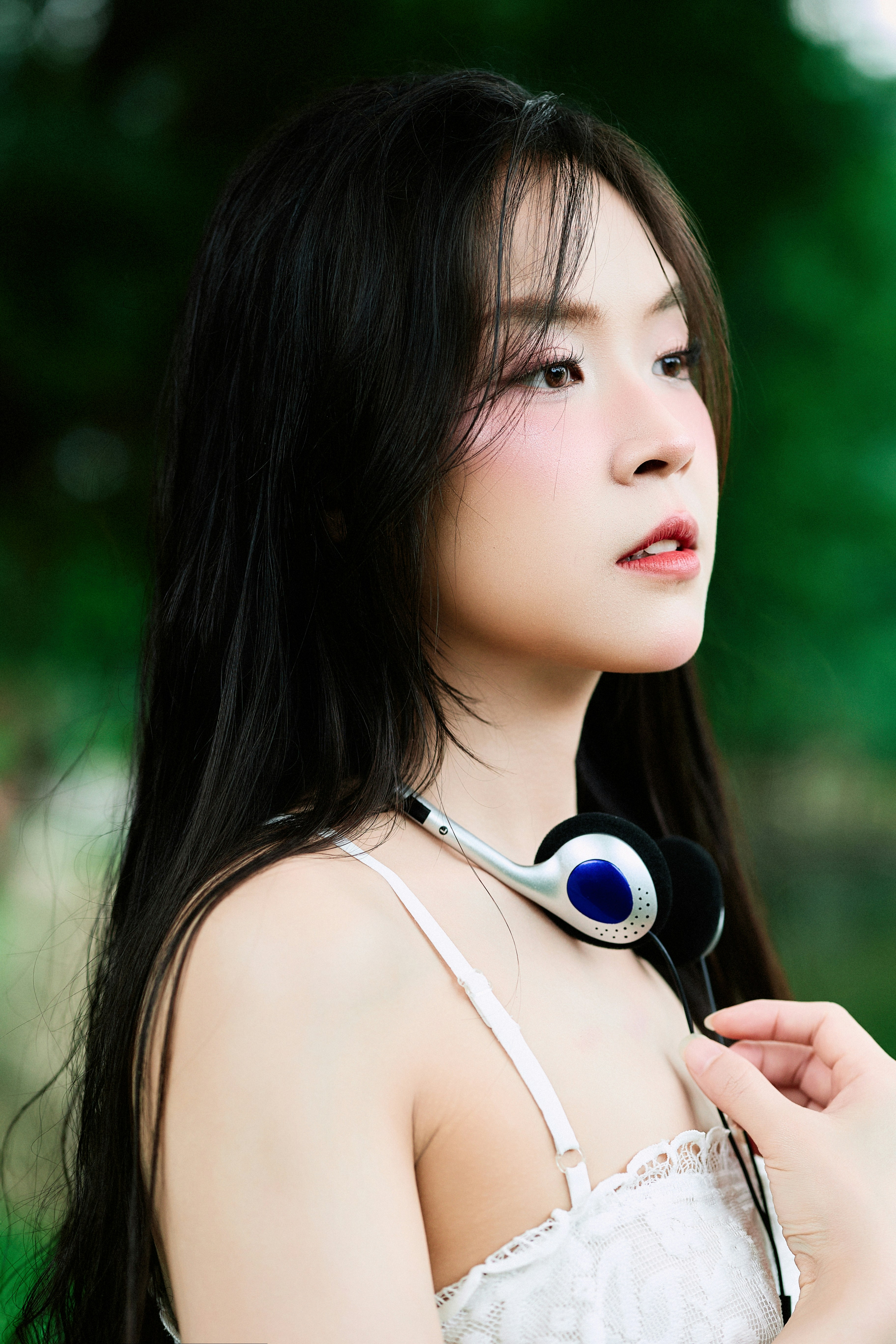 Velvet Whisper: A Portrait in Soft Focus and Green Backdrop