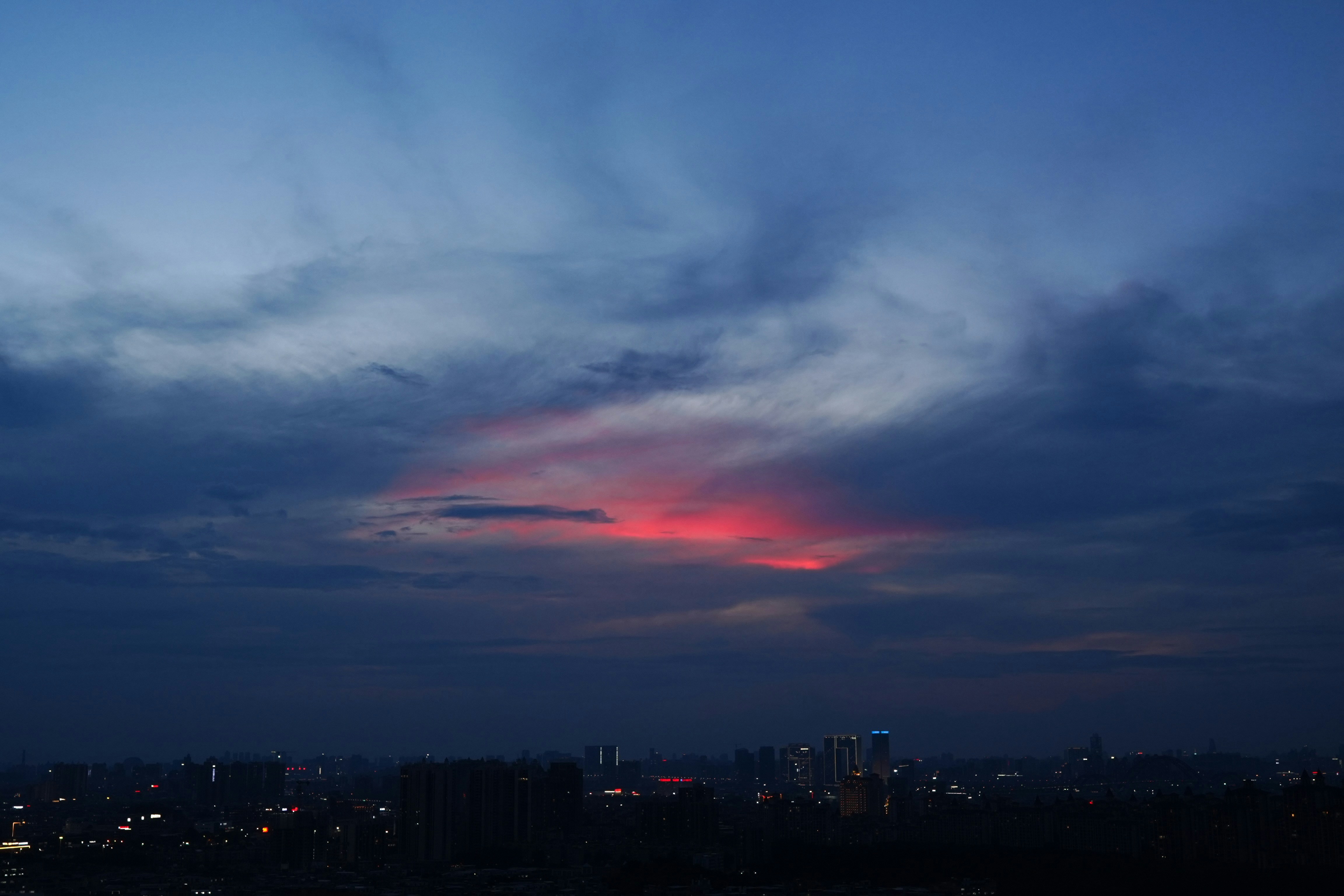 Dusk over the City: A Quiet Horizon with Faint Neon