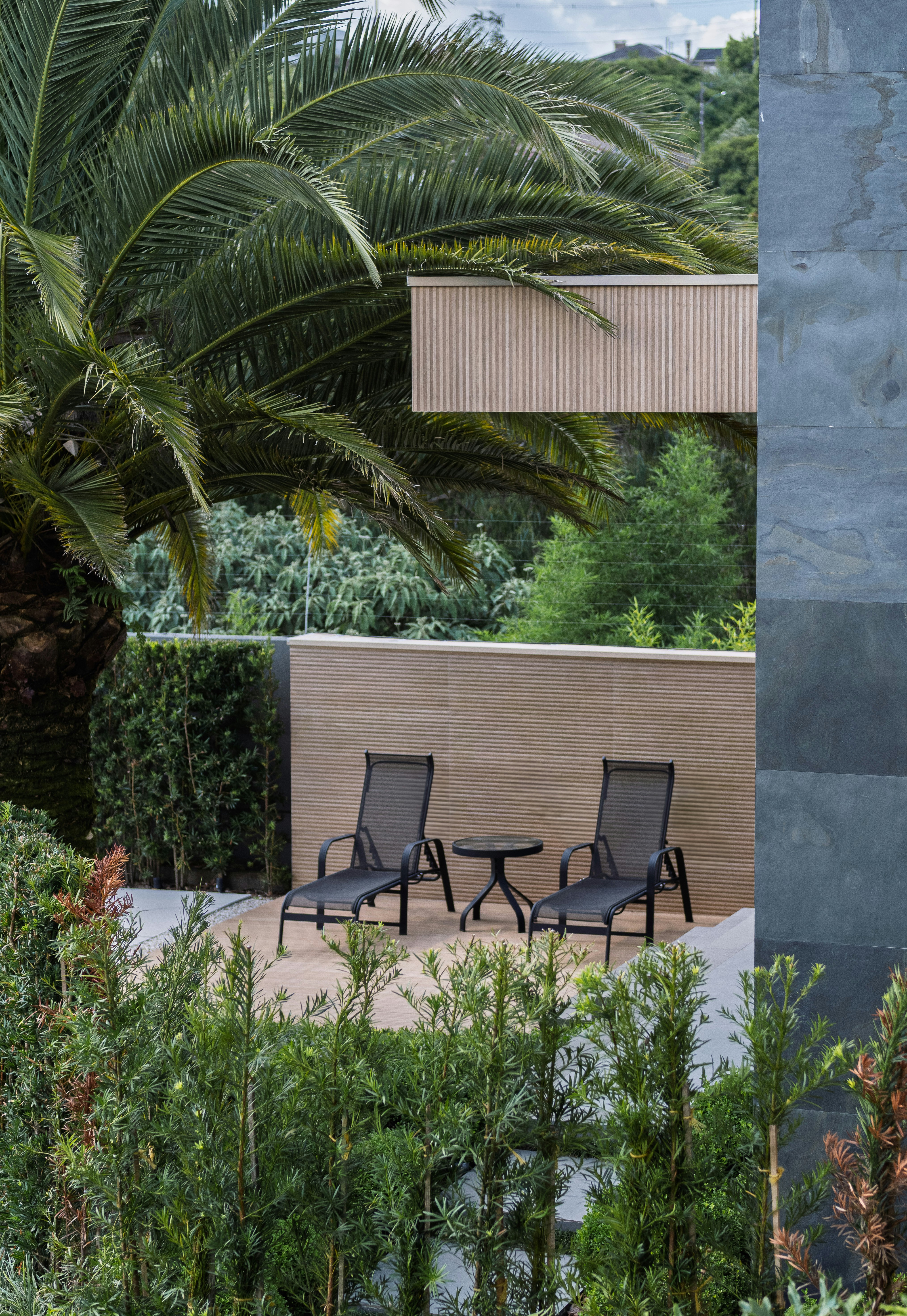 Shaded Terrace Rendezvous under a Fringed Canopy