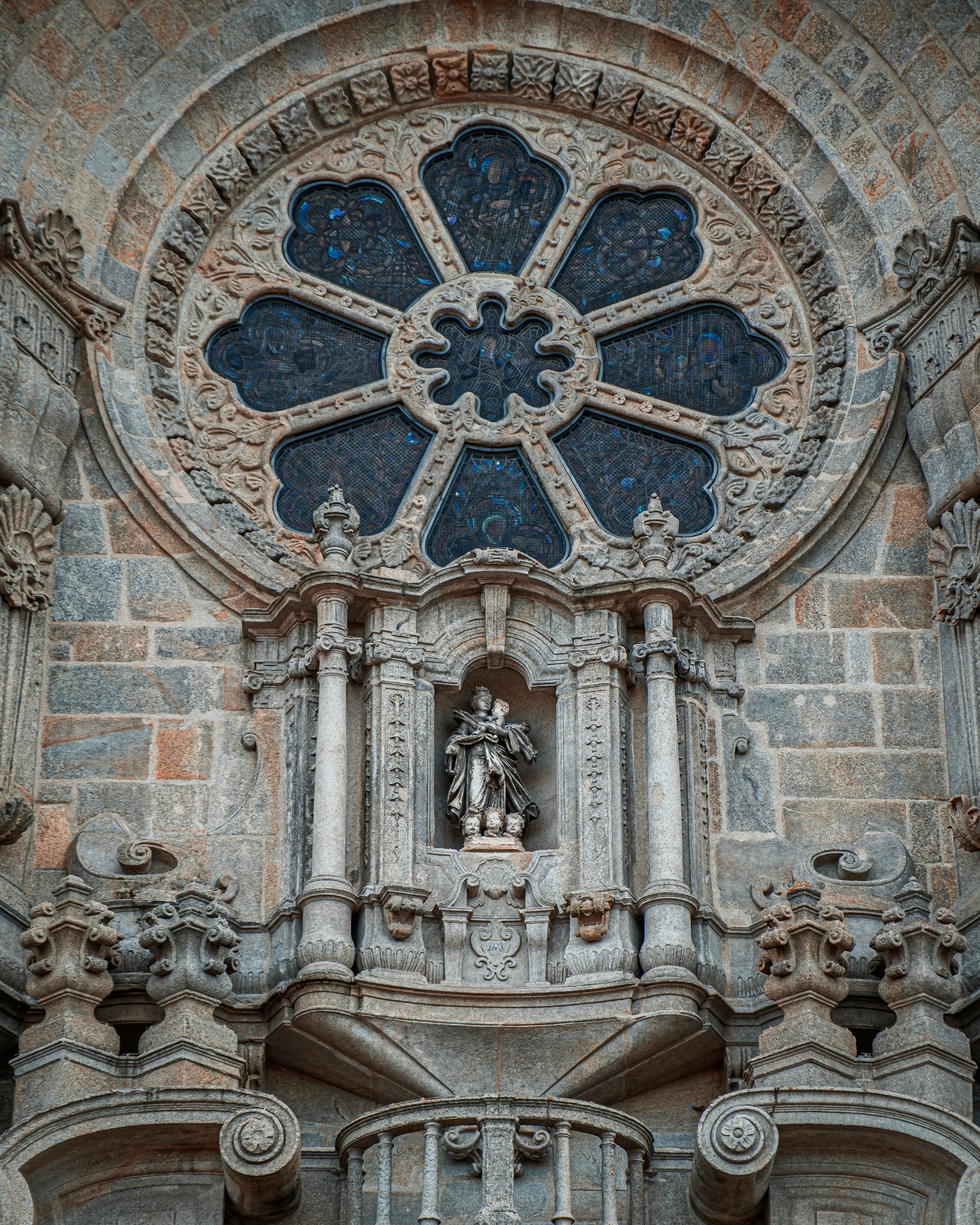Stone Rose Window Balcony: Carved Facade of a Gothic Revival Chapel