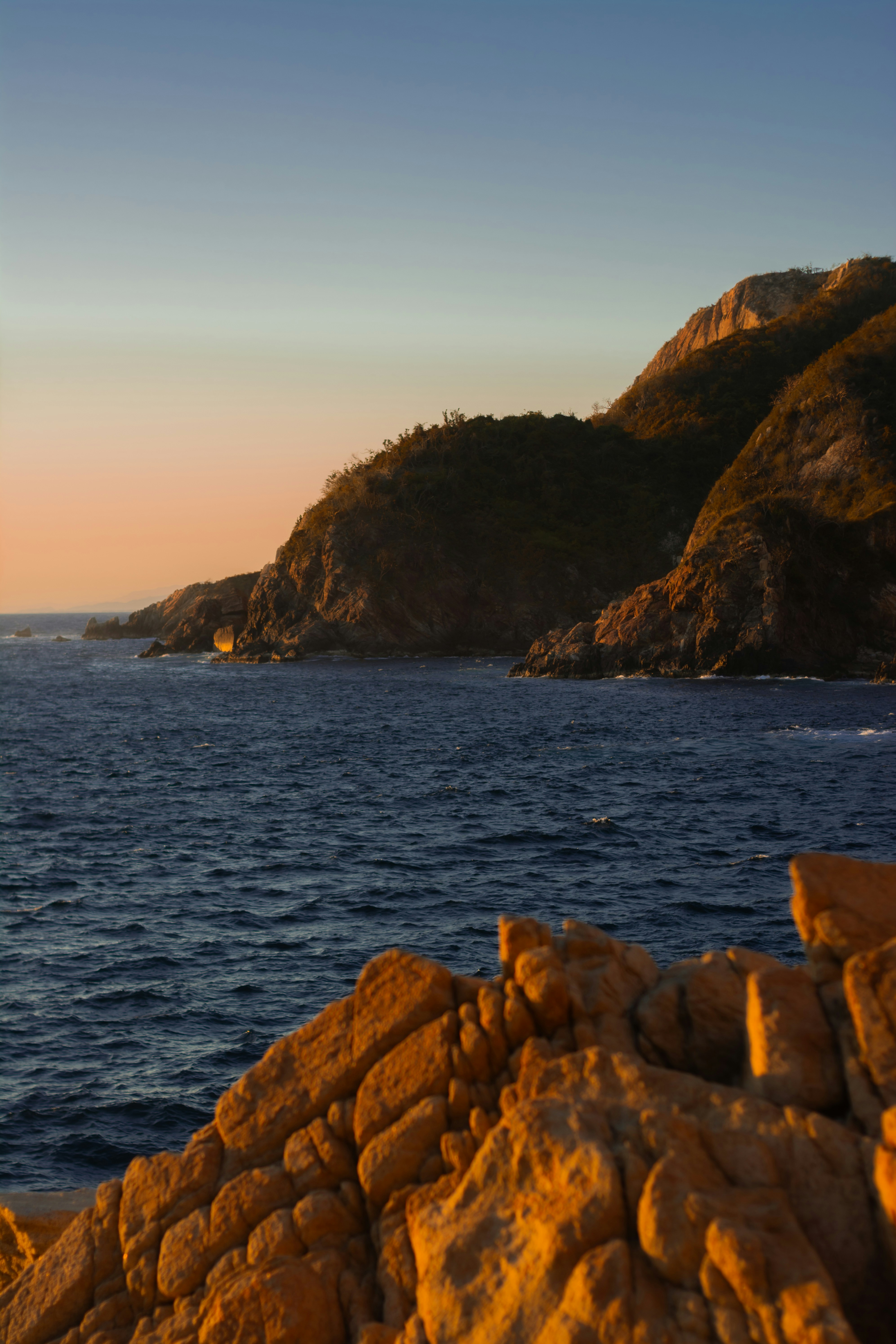 Golden Sunset Over Rugged Coastal Cliffs