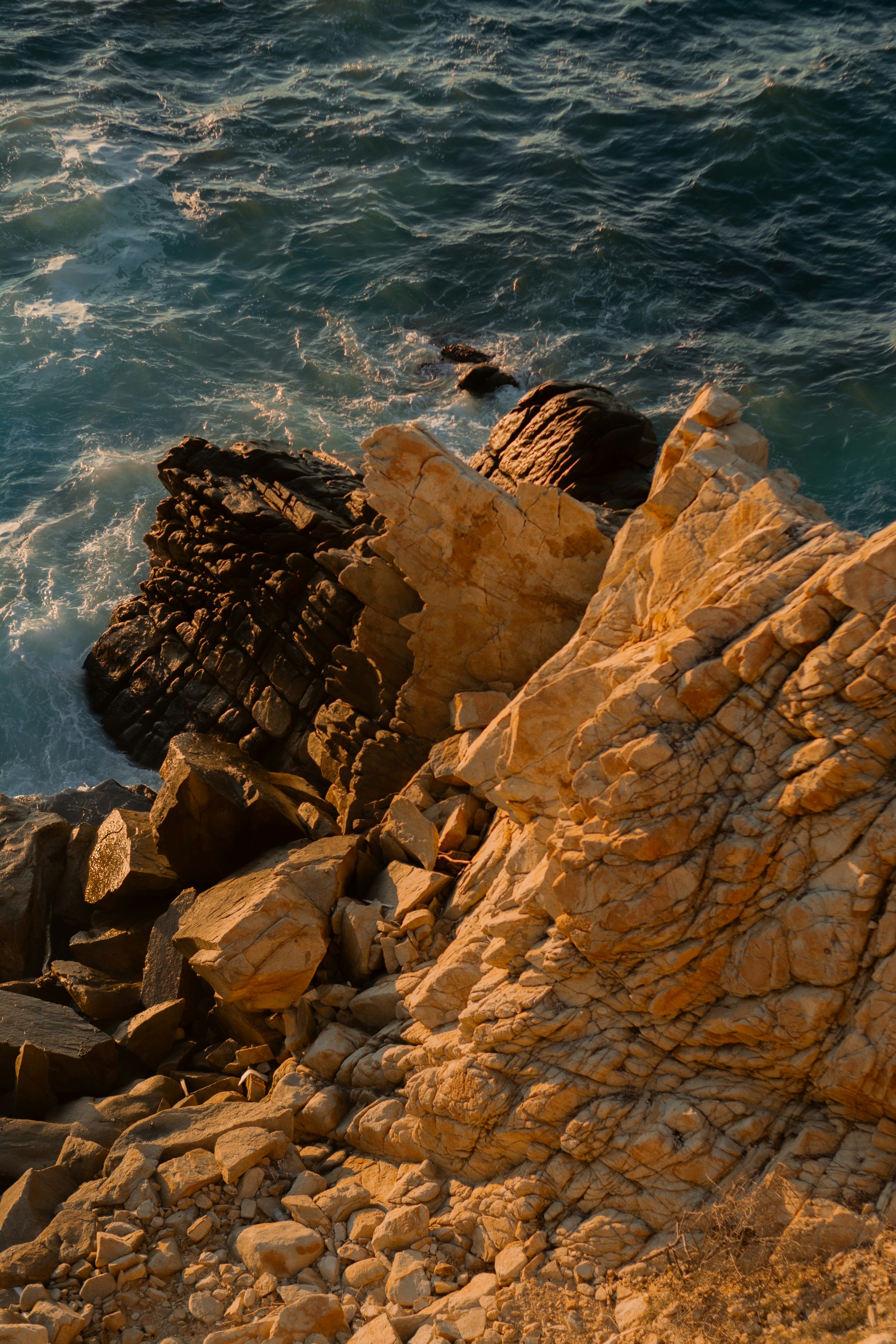 Golden Cliff Terrain Meeting the Sea