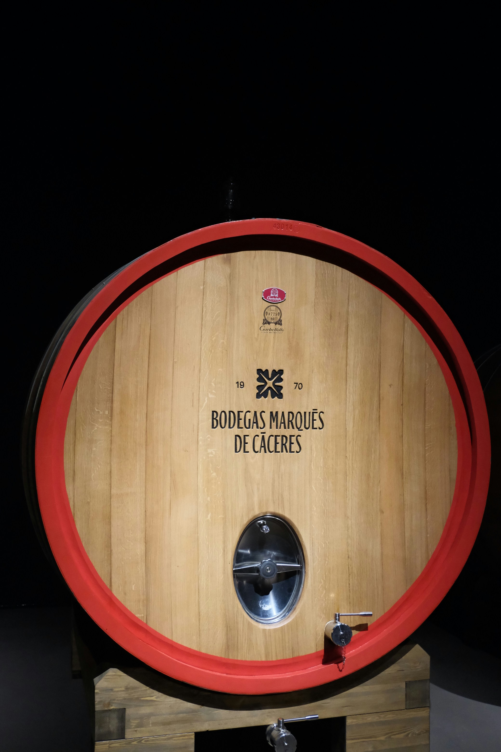 Red Barrel, Dark Stage: The Oak Wine Barrel Stands in Silence