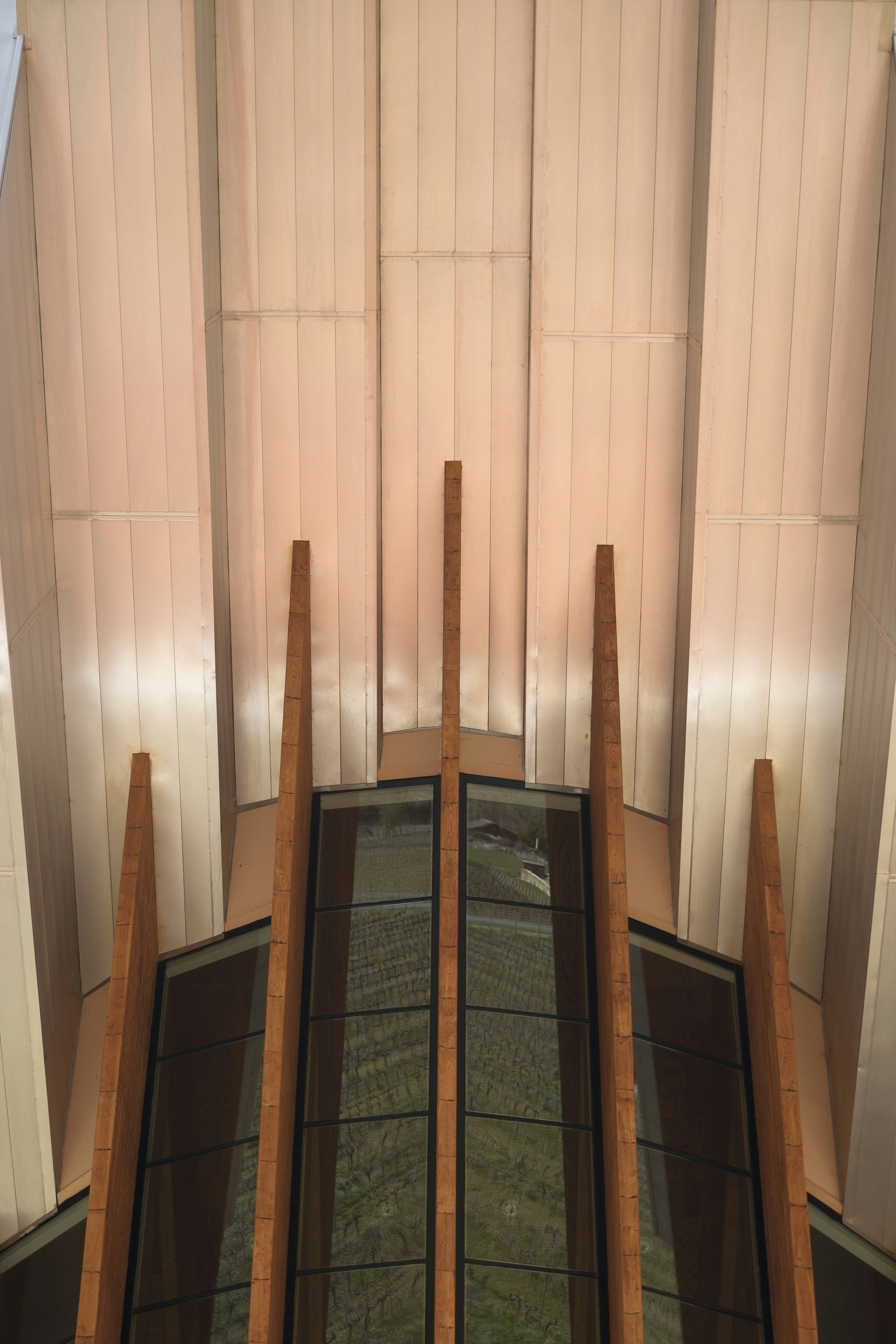 Celestial Windows: Vertical Struts Framing a Skyward Corridor