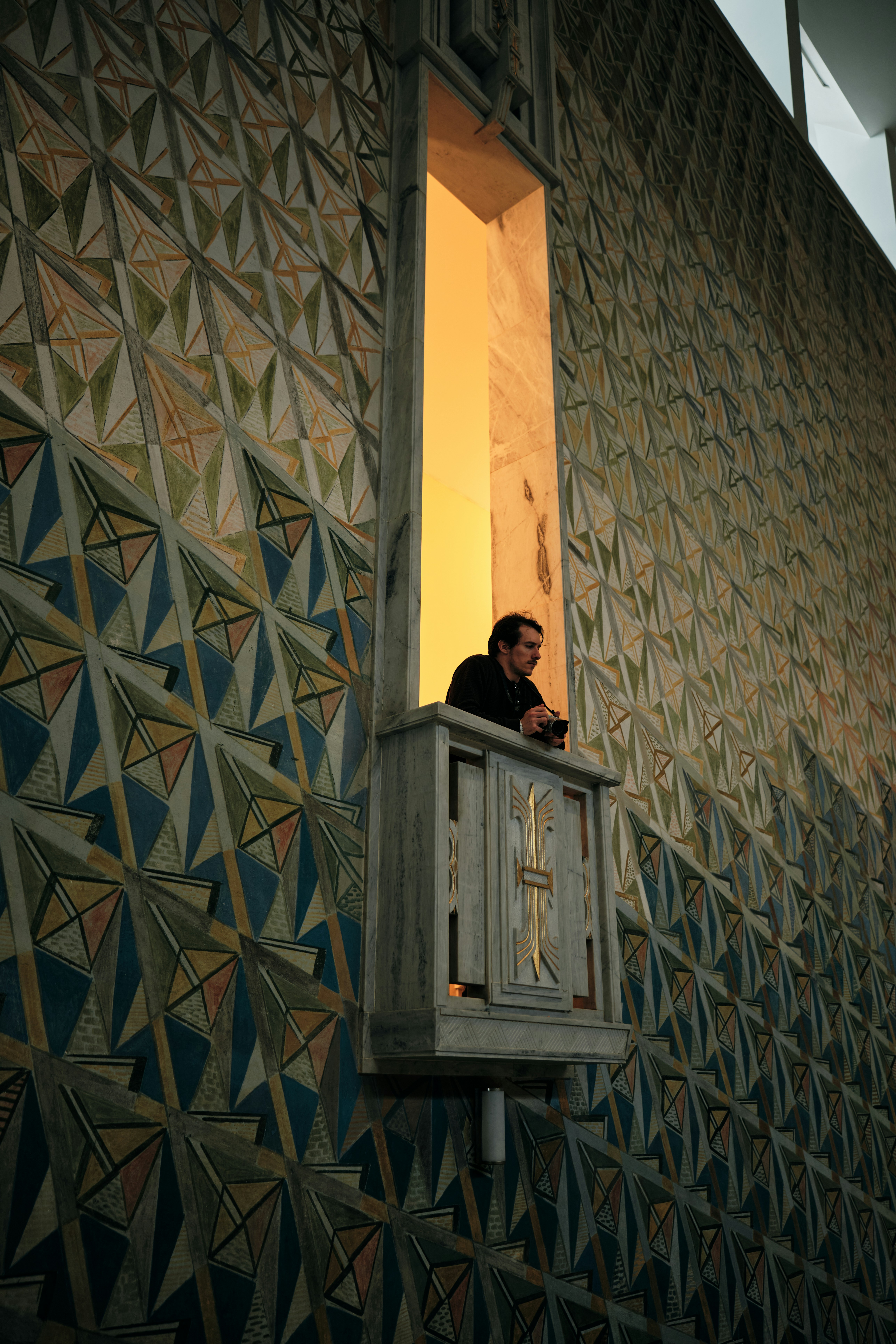 Balcony Quiet: A Figure in the Golden Threshold