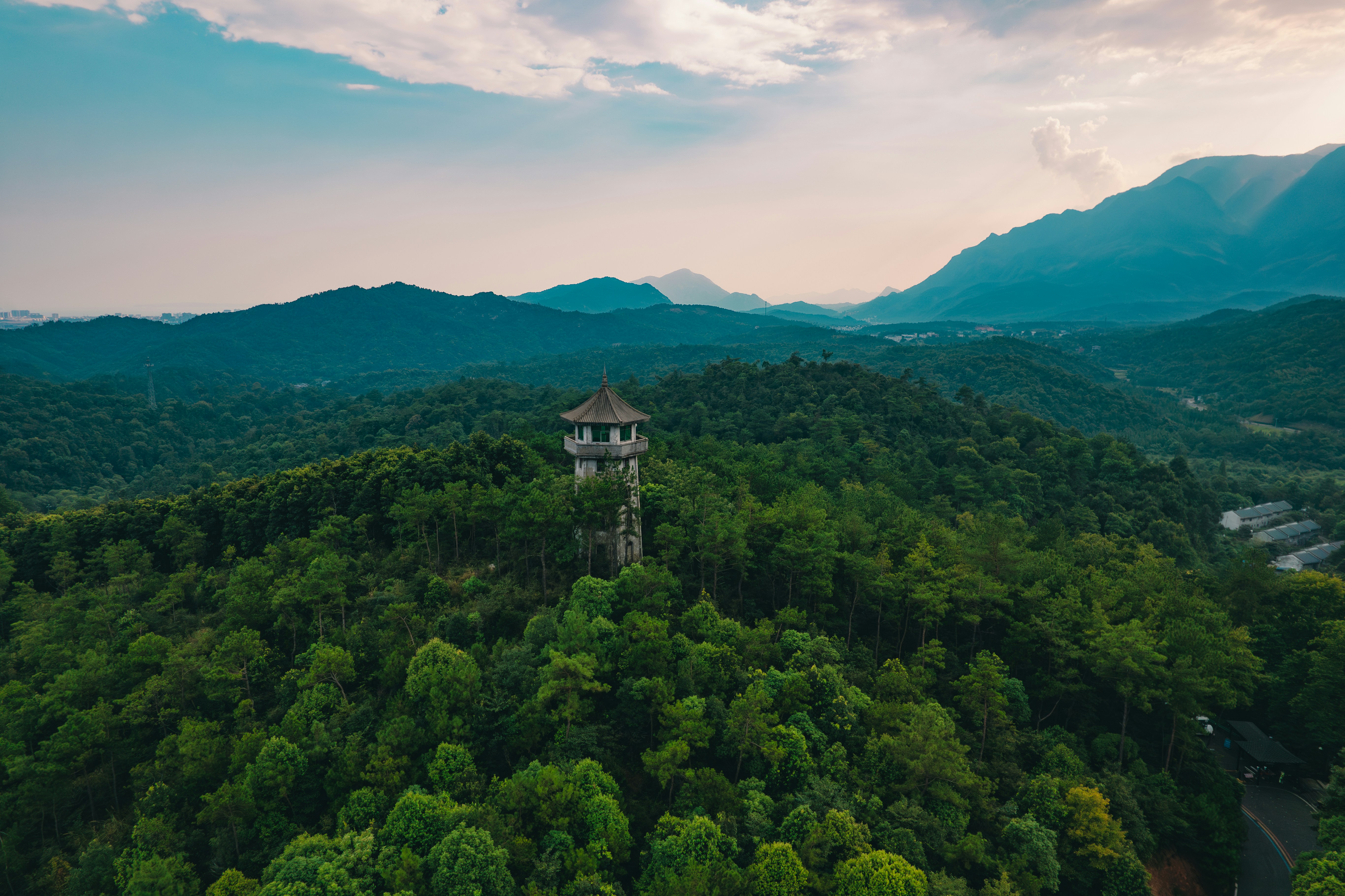 Watchtower Amid Verdant Hills: A Serene Drone Summit