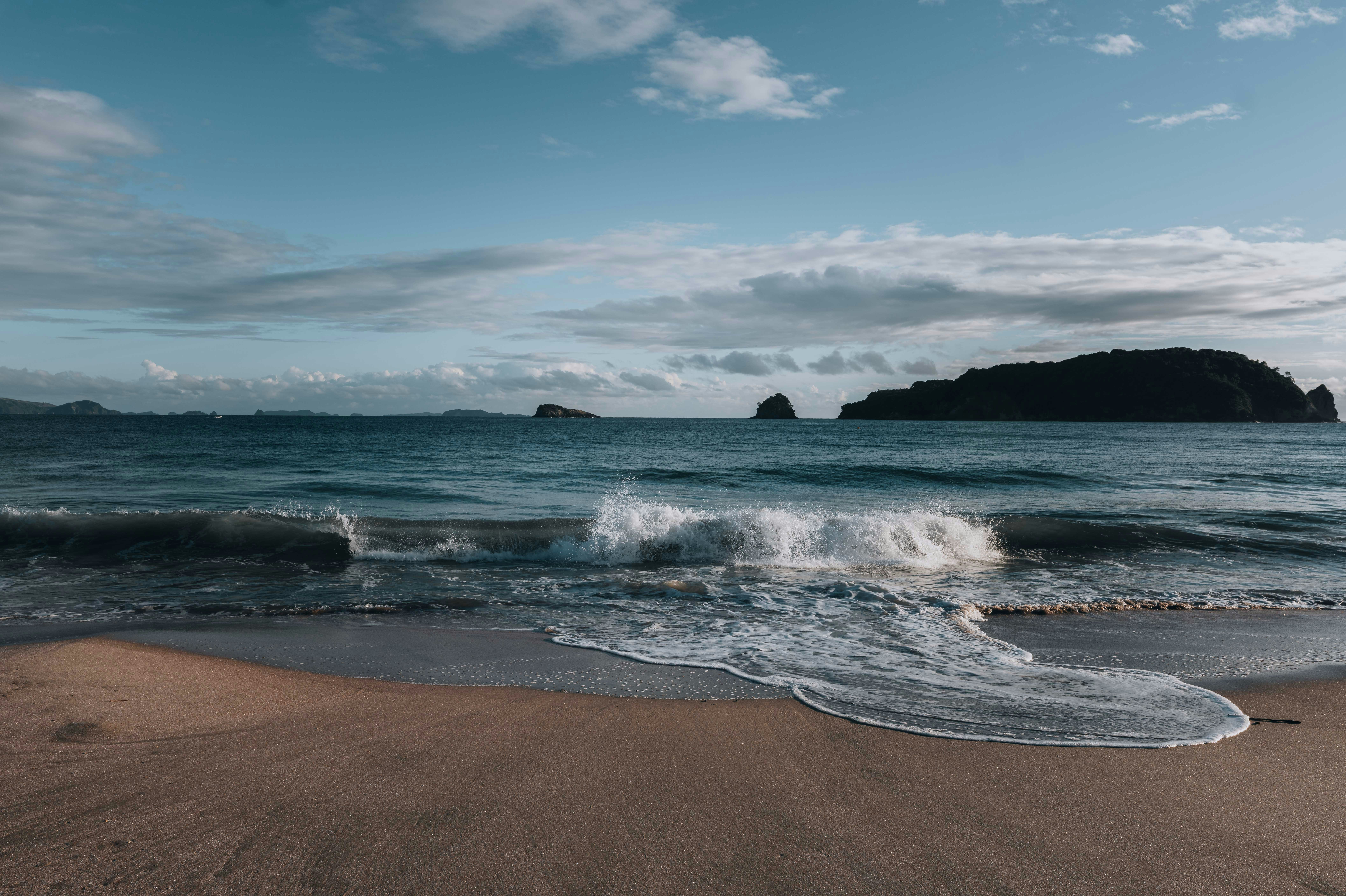 Coastal Quiet: Wavelets Meet the Dune at Distant Islands