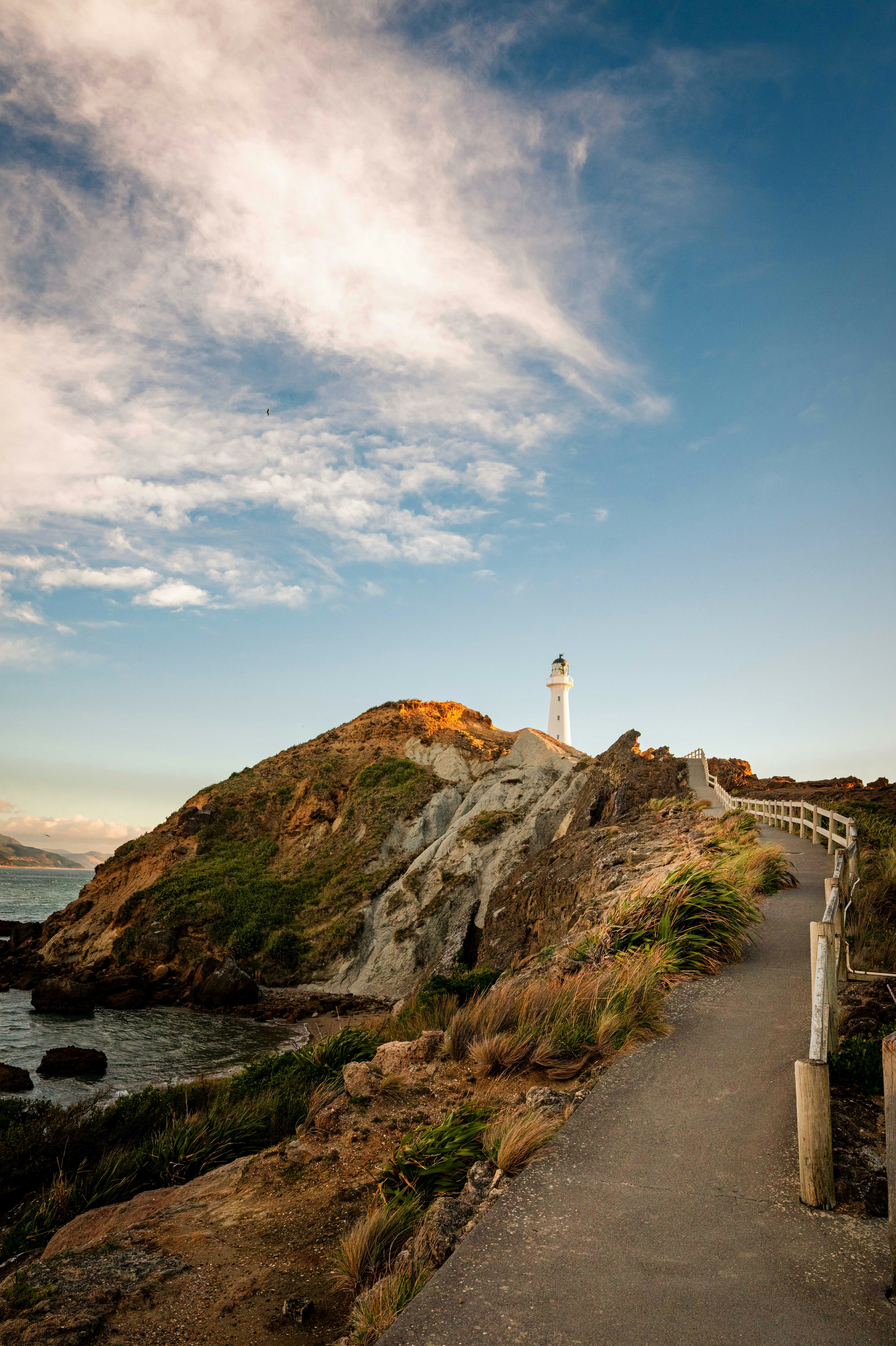 Lighthouse Over Clifftop Path at Golden Hour