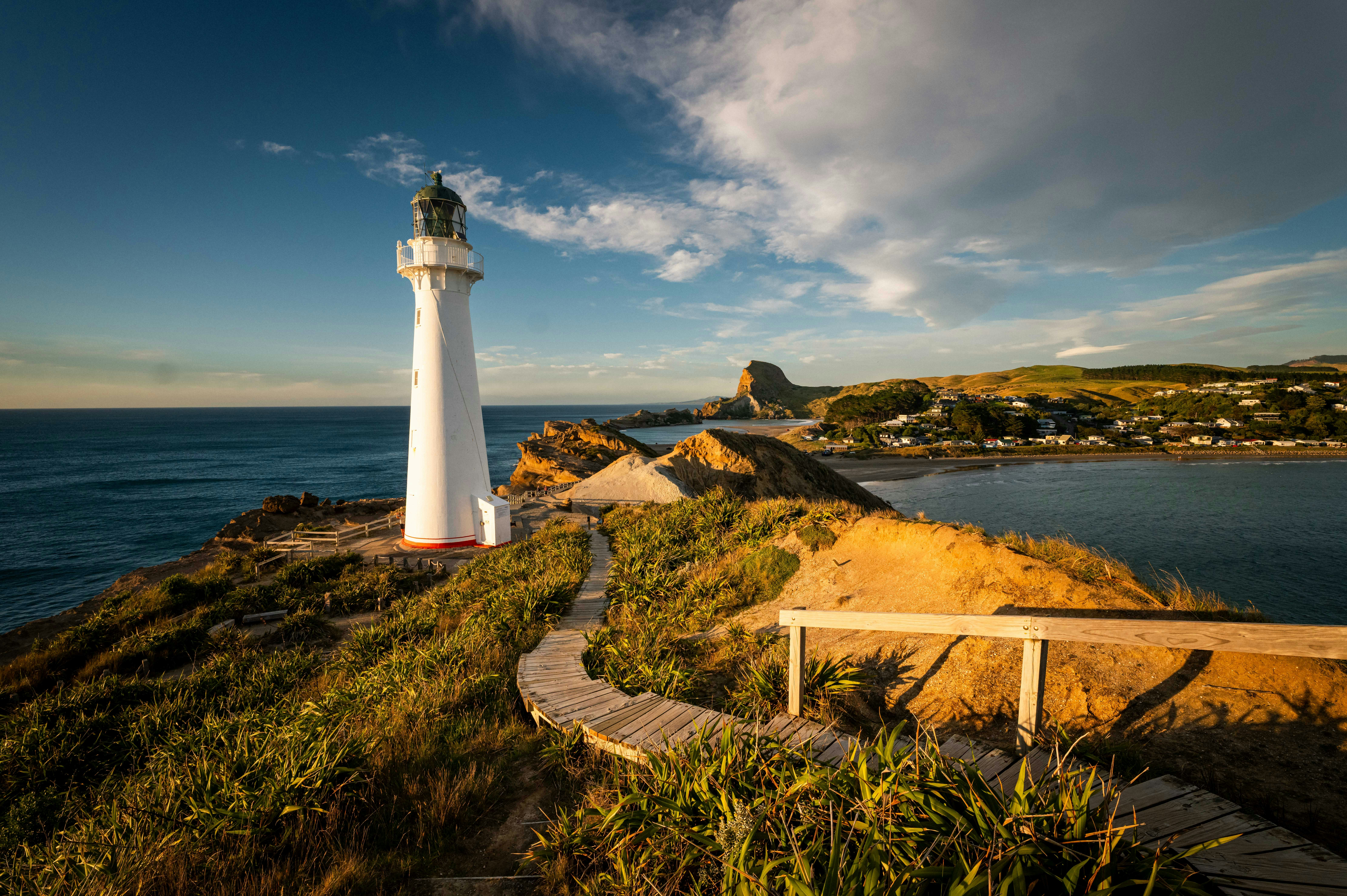 Beacon on the Cliff: A Sunlit Path to the Sea