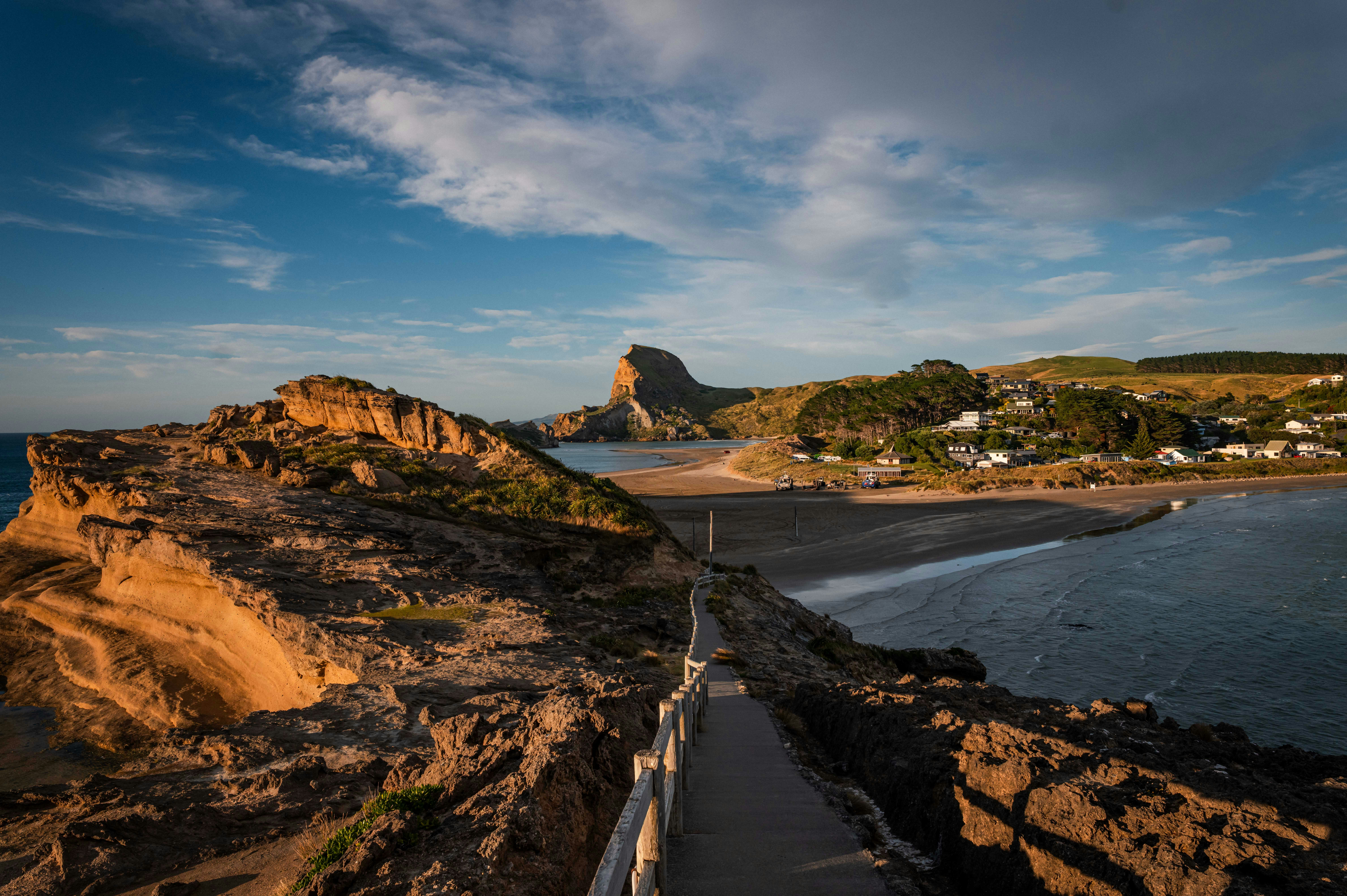  cliffside promenade toward sunlit coastline town