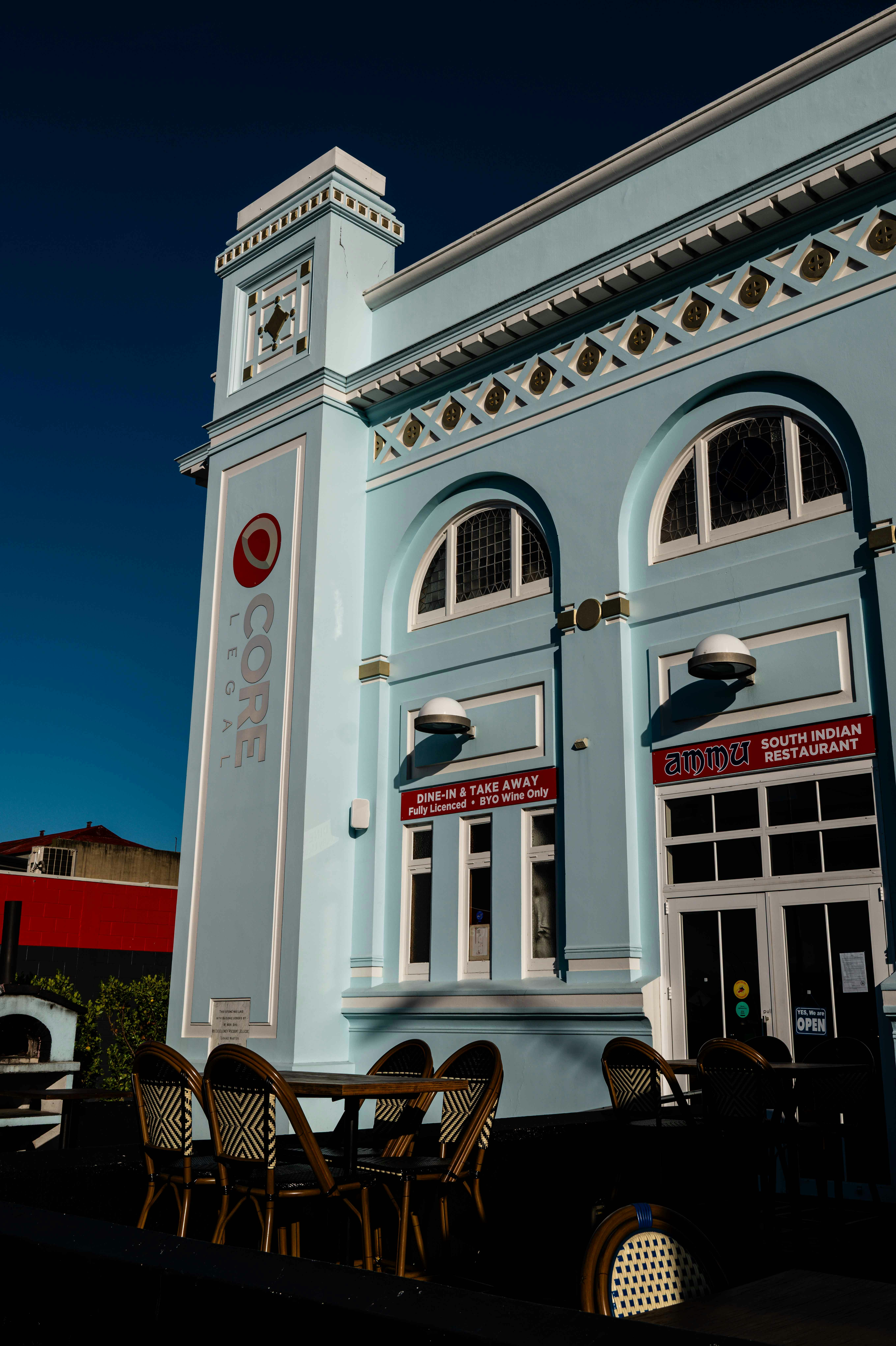 Aqua façade: Coral-blue corner of a coastal restaurant