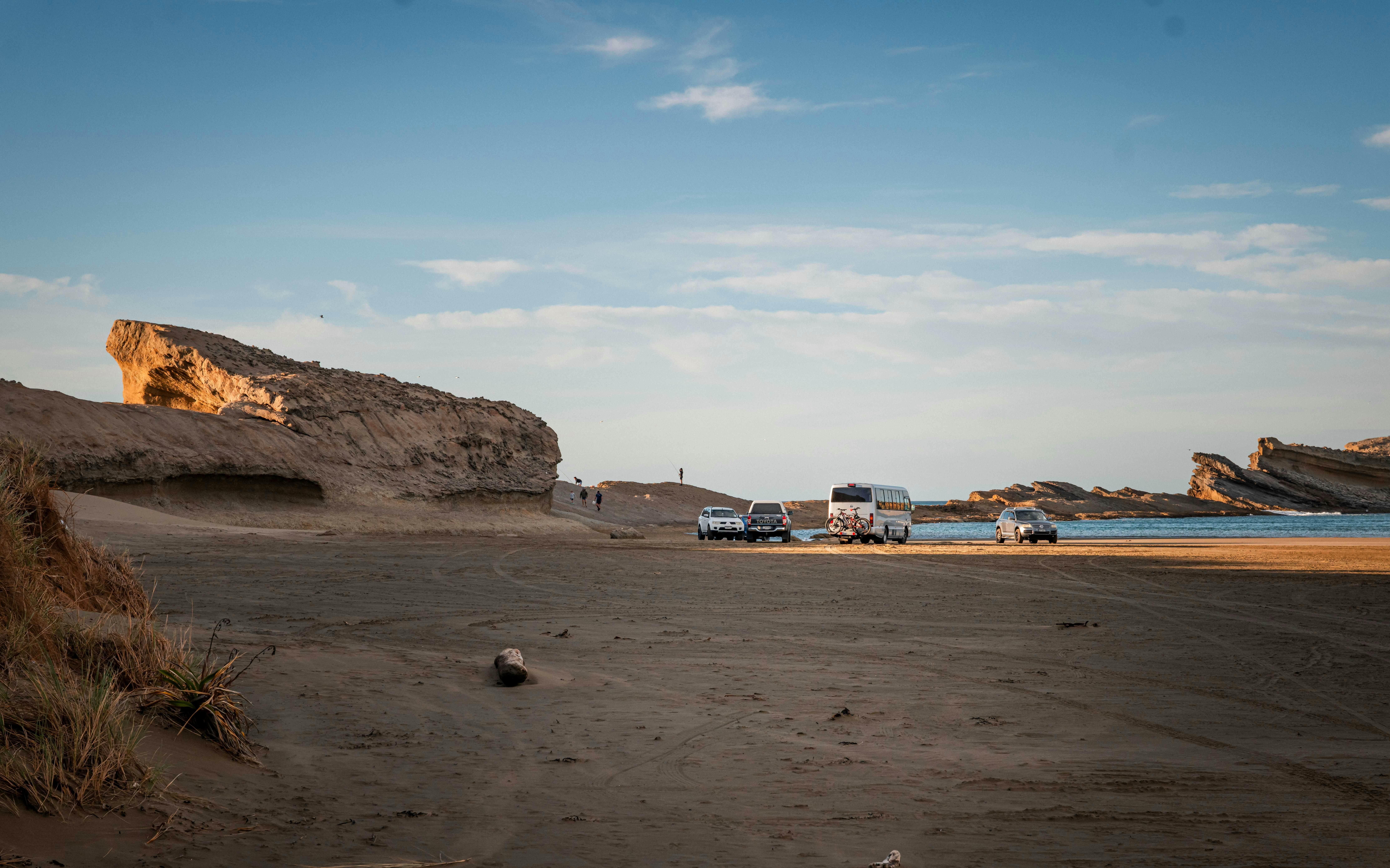 Coastal Vessels at Dusk: A Quiet Beach Rendezvous