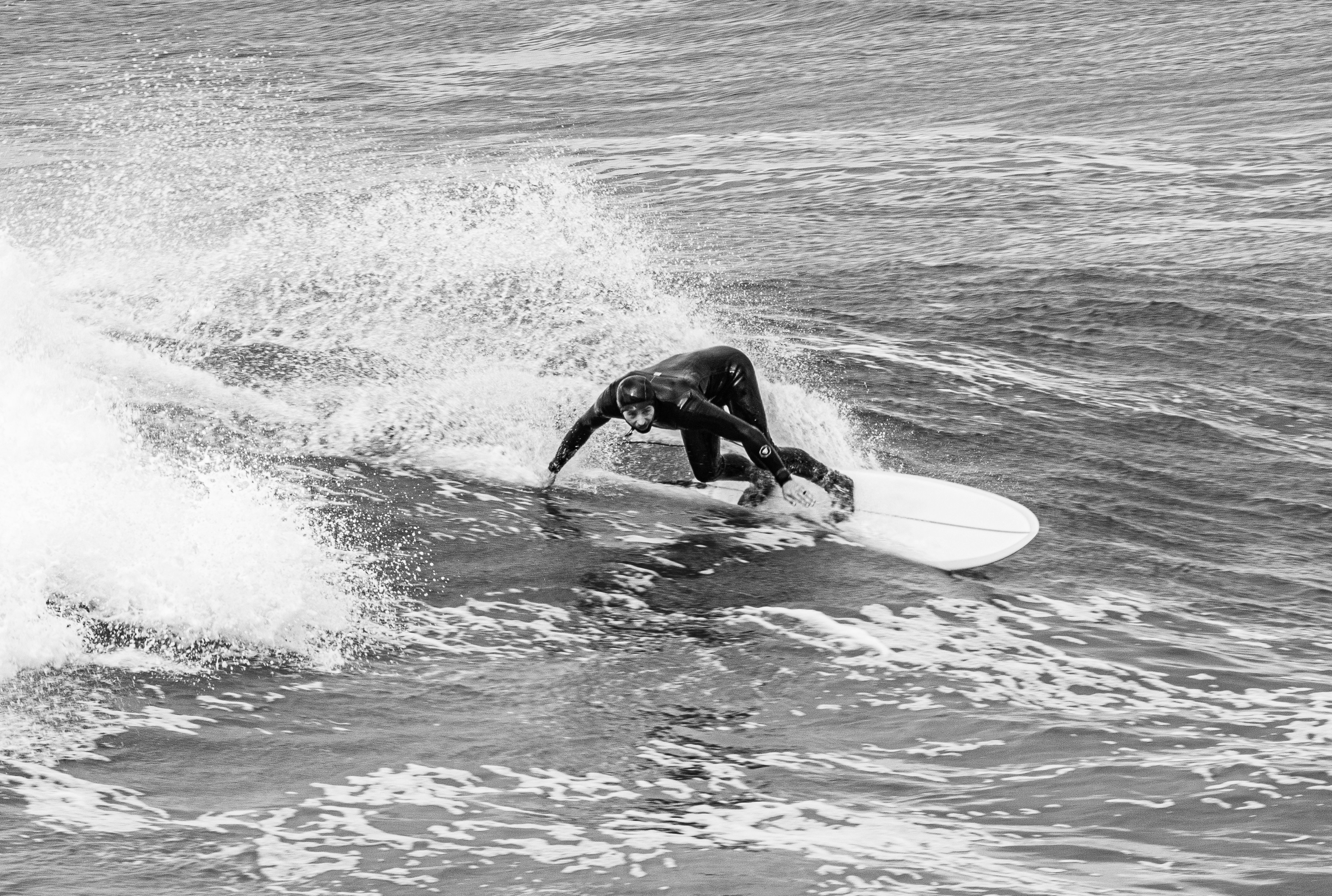 Centered Carve: Surfer Arcing into the Wave