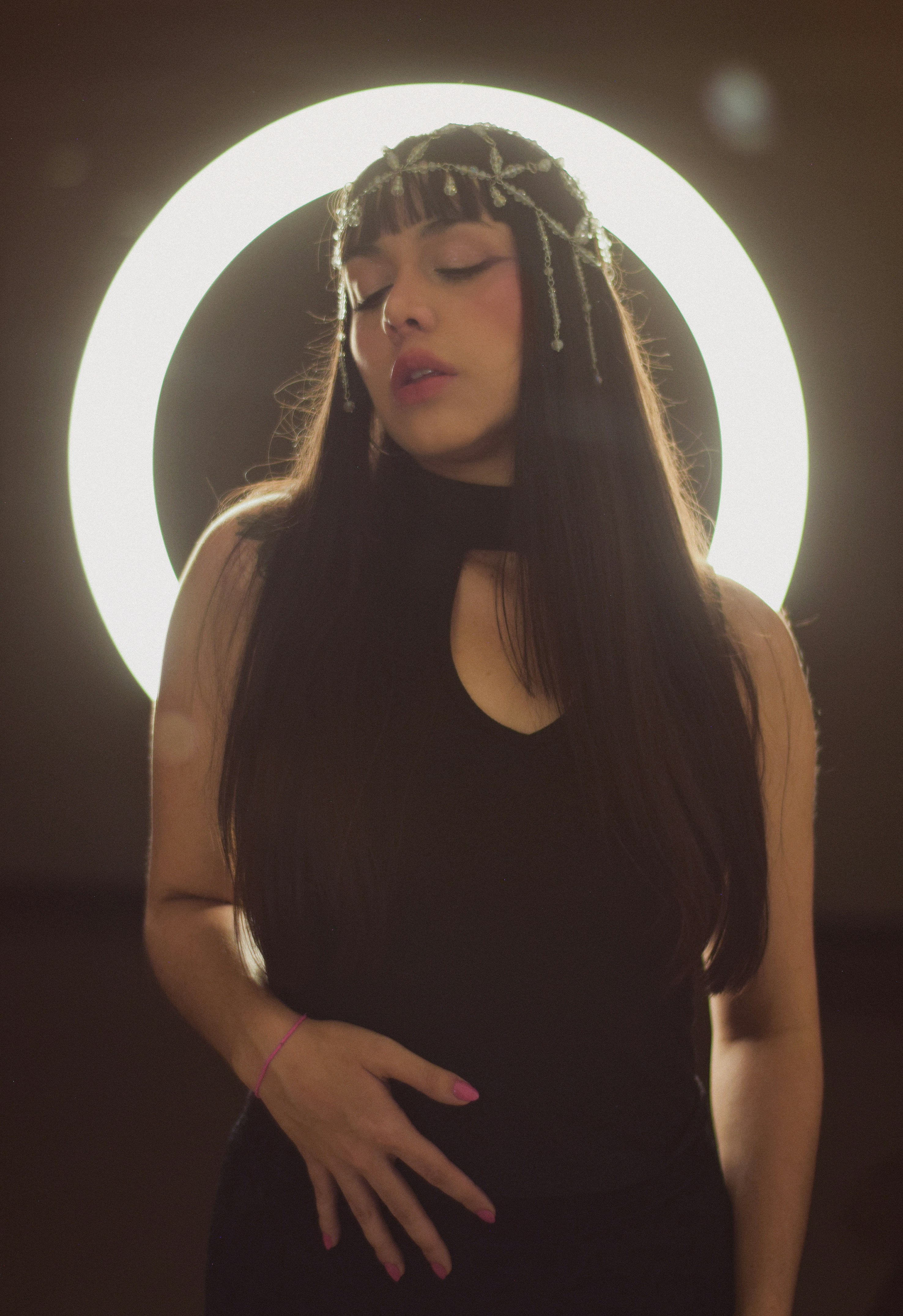 Halo of Light: Portrait Beneath a Circular Glow